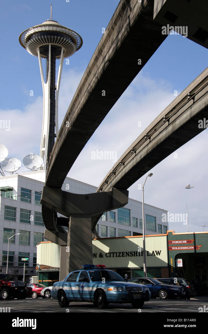 Seattle police department car passing under the Space Needle and ...