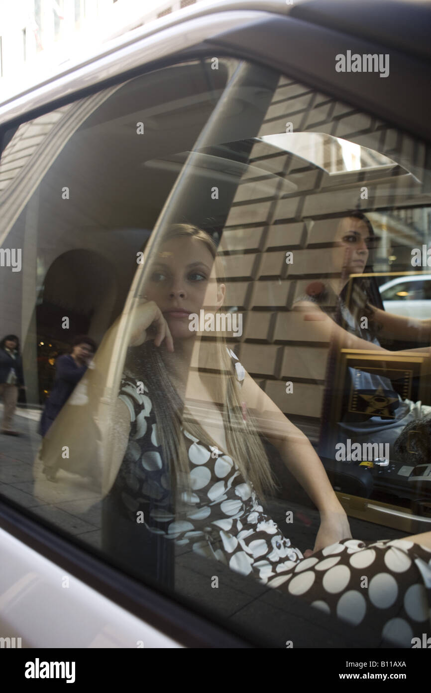Young woman seated in parked white Range Rover Sport Stock Photo - Alamy
