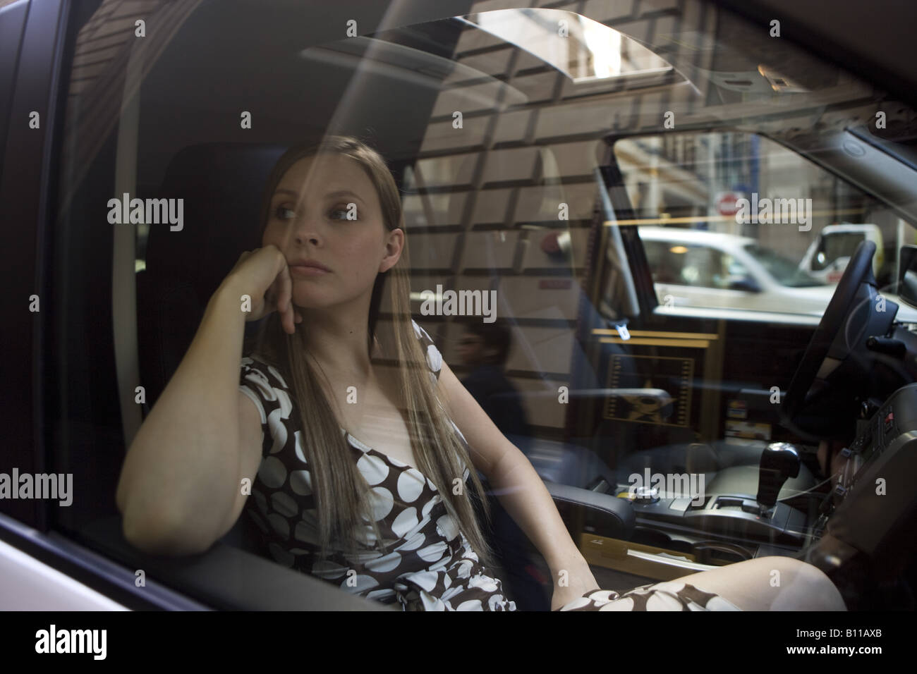 Young woman seated in parked white Range Rover Sport Stock Photo - Alamy