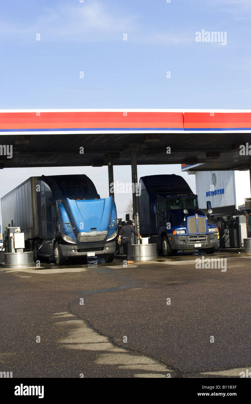 Trucks filling up with gas at service station Stock Photo - Alamy