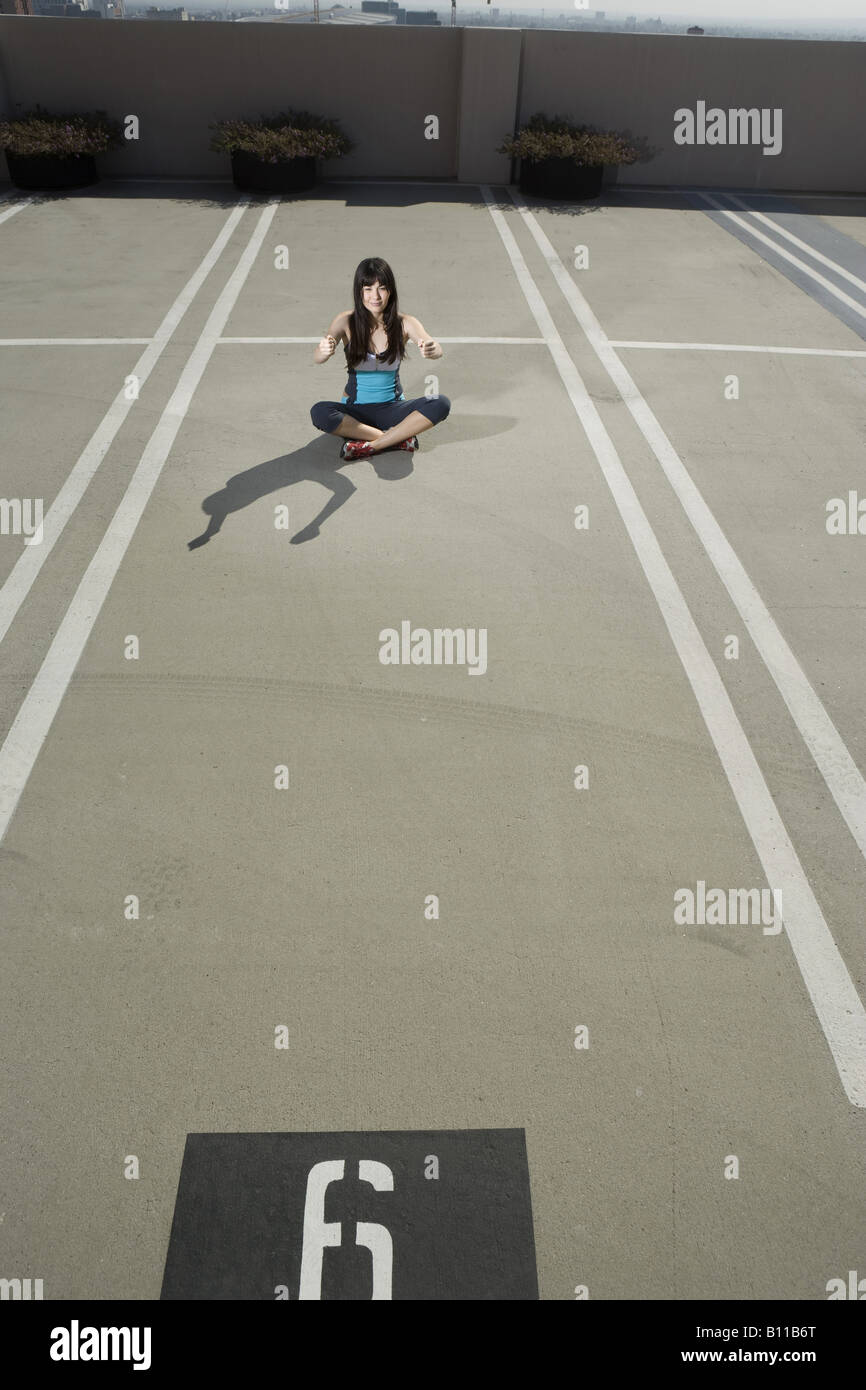 Woman seated on rooftop hi-res stock photography and images - Alamy