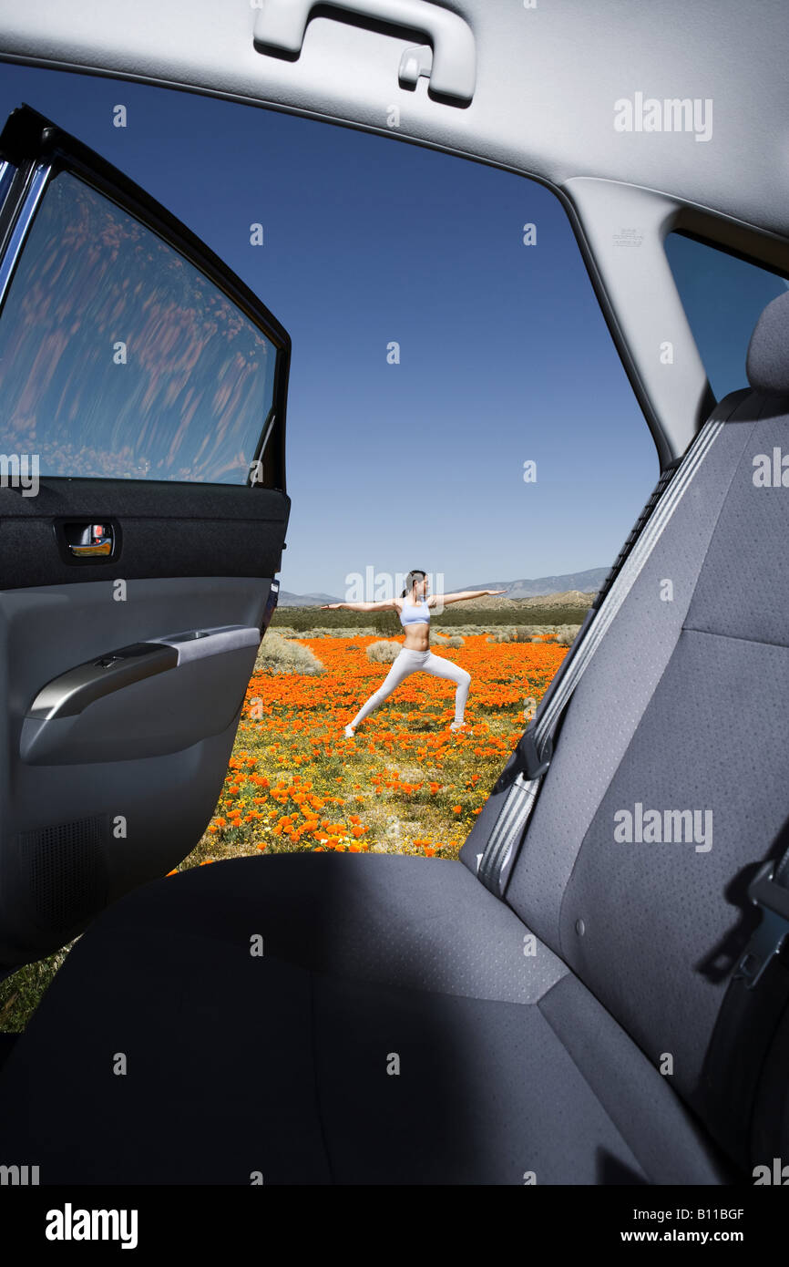 View of young woman practicing yoga from interior of Toyota Prius Stock ...
