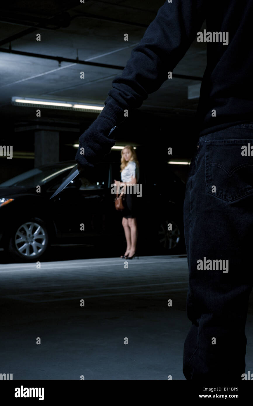 Woman sees prowler with knife as she unlocks her parked car Stock Photo ...