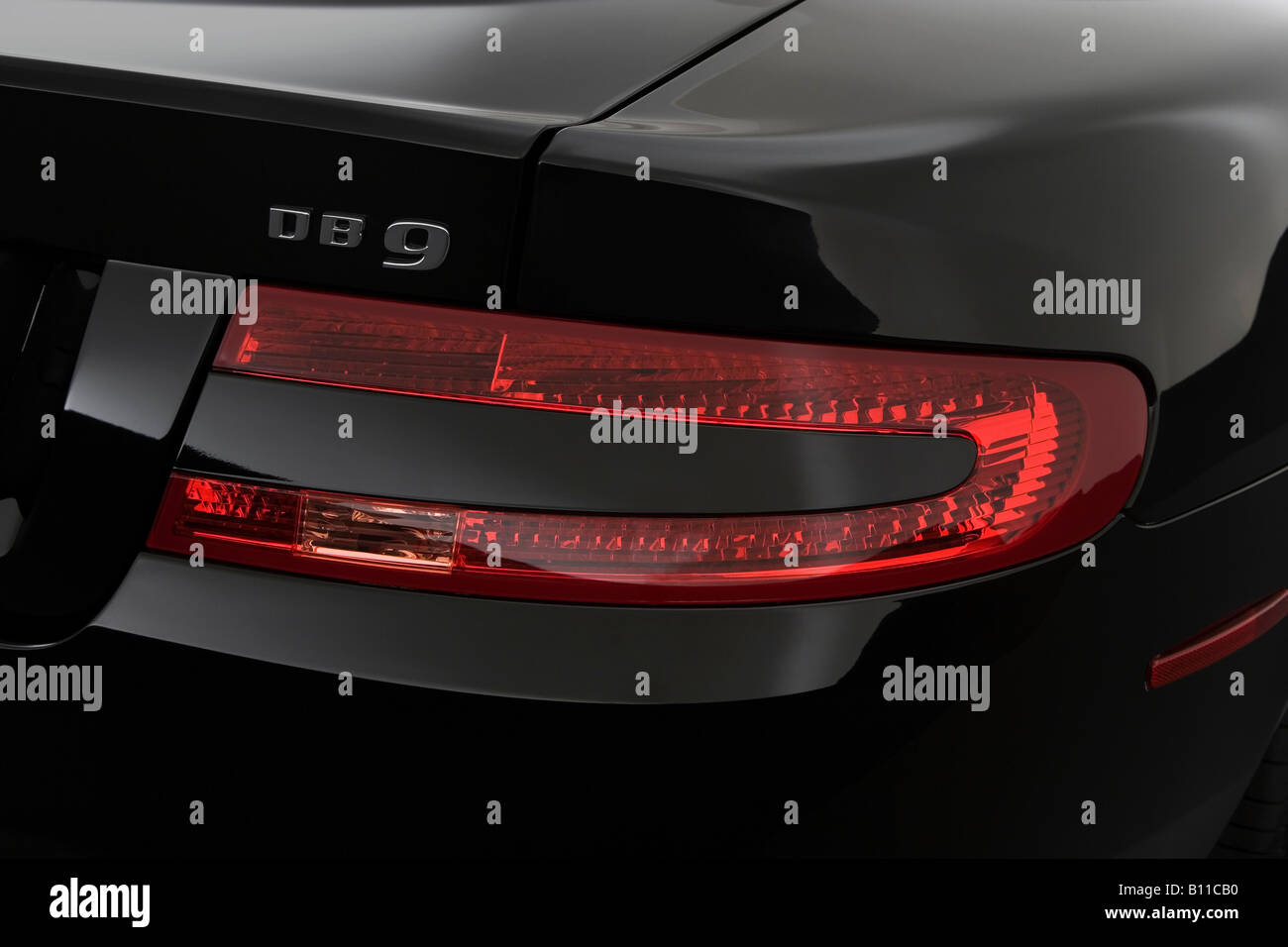2008 Aston Martin DB9 in Black - Tail light Stock Photo - Alamy