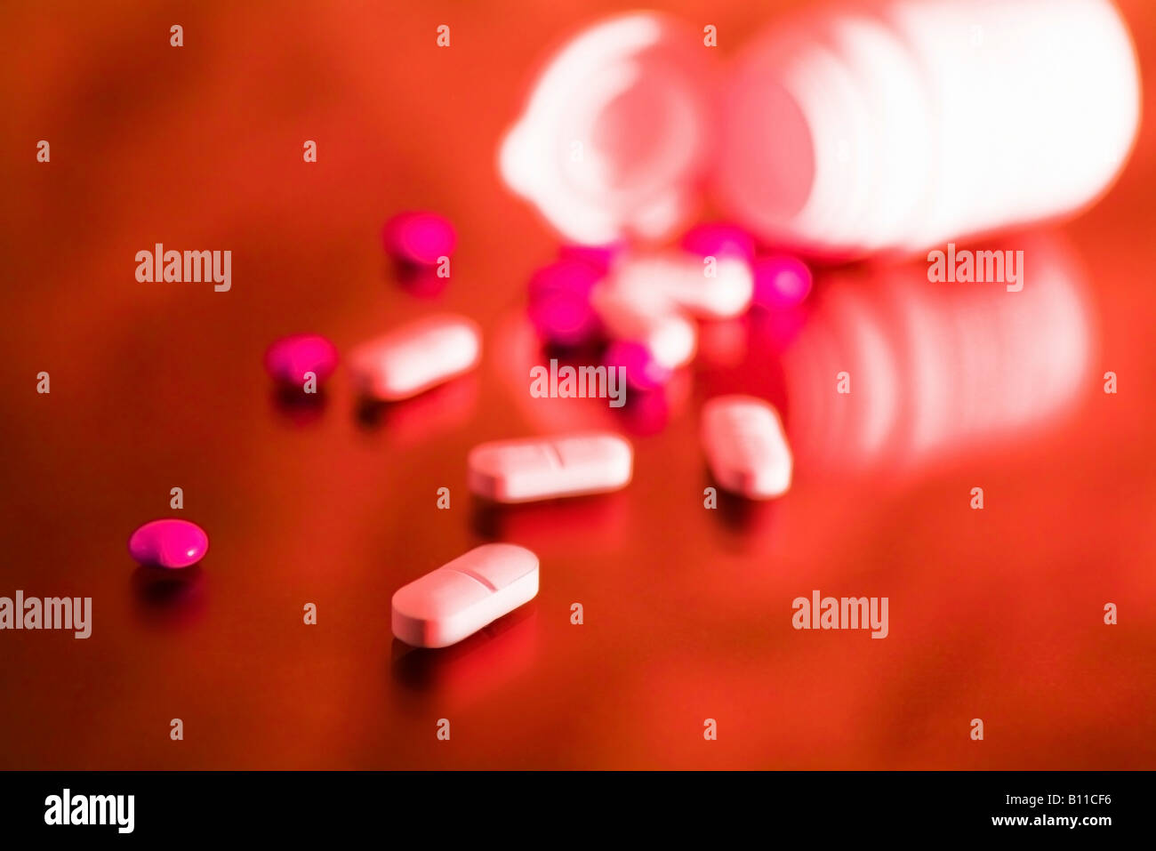 Medical tablets on a reflective glass surface Stock Photo - Alamy