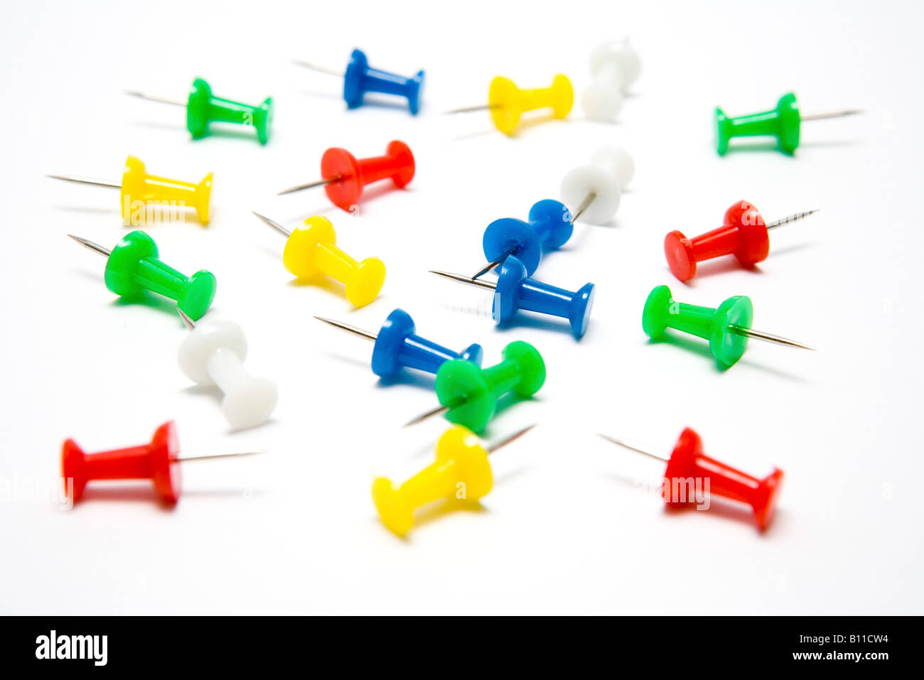 Pushpins on a white background Stock Photo - Alamy