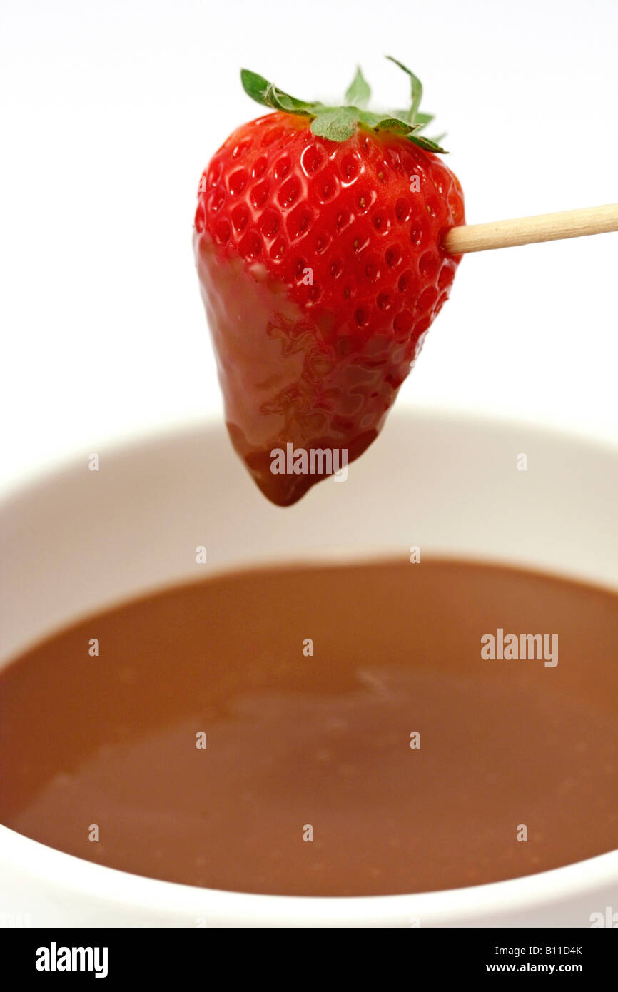 Kitchen preparation white chocolate dipped strawberries hi-res stock ...