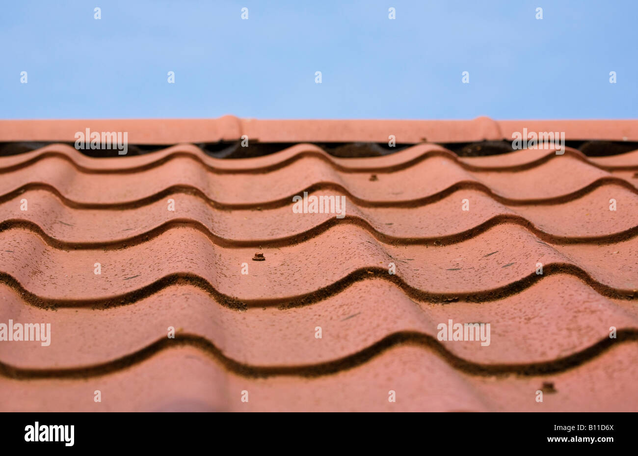 Red ridge roof tiles Stock Photo - Alamy