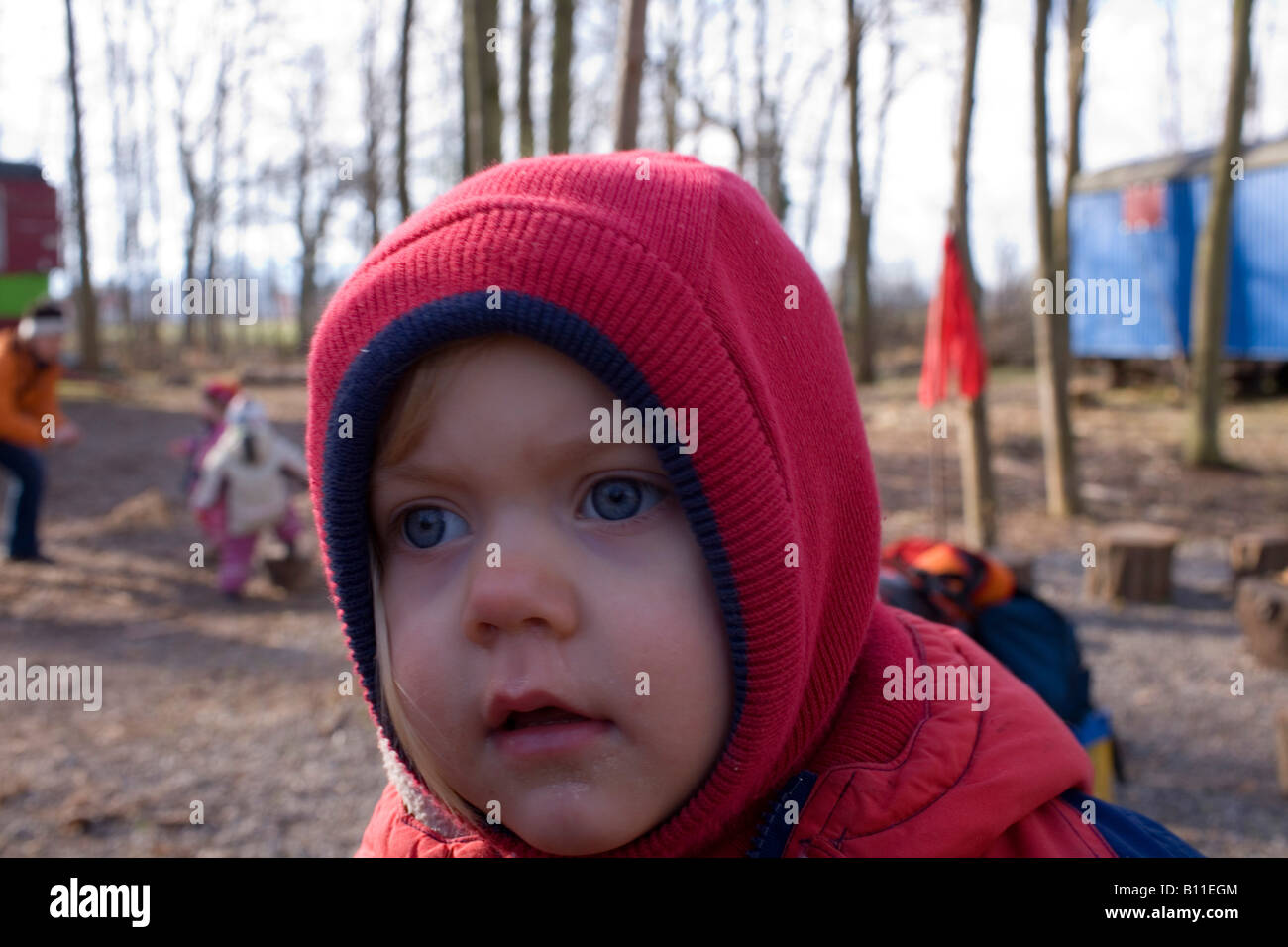 Children playing in the forest kindergarden Stock Photo - Alamy