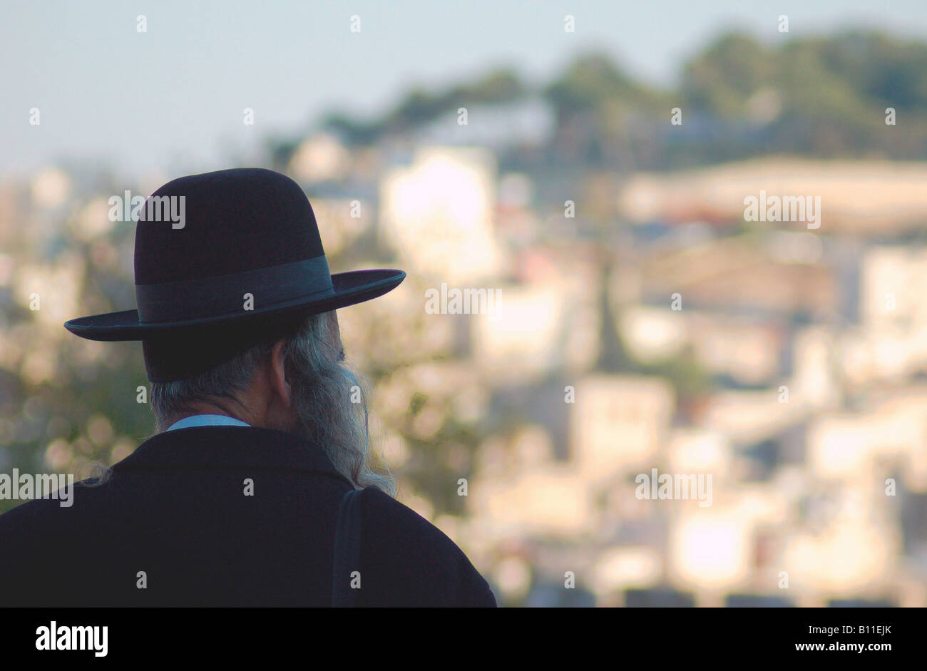 A religious Jewish man looks east from the Dung Gate of Jerusalem's Old ...