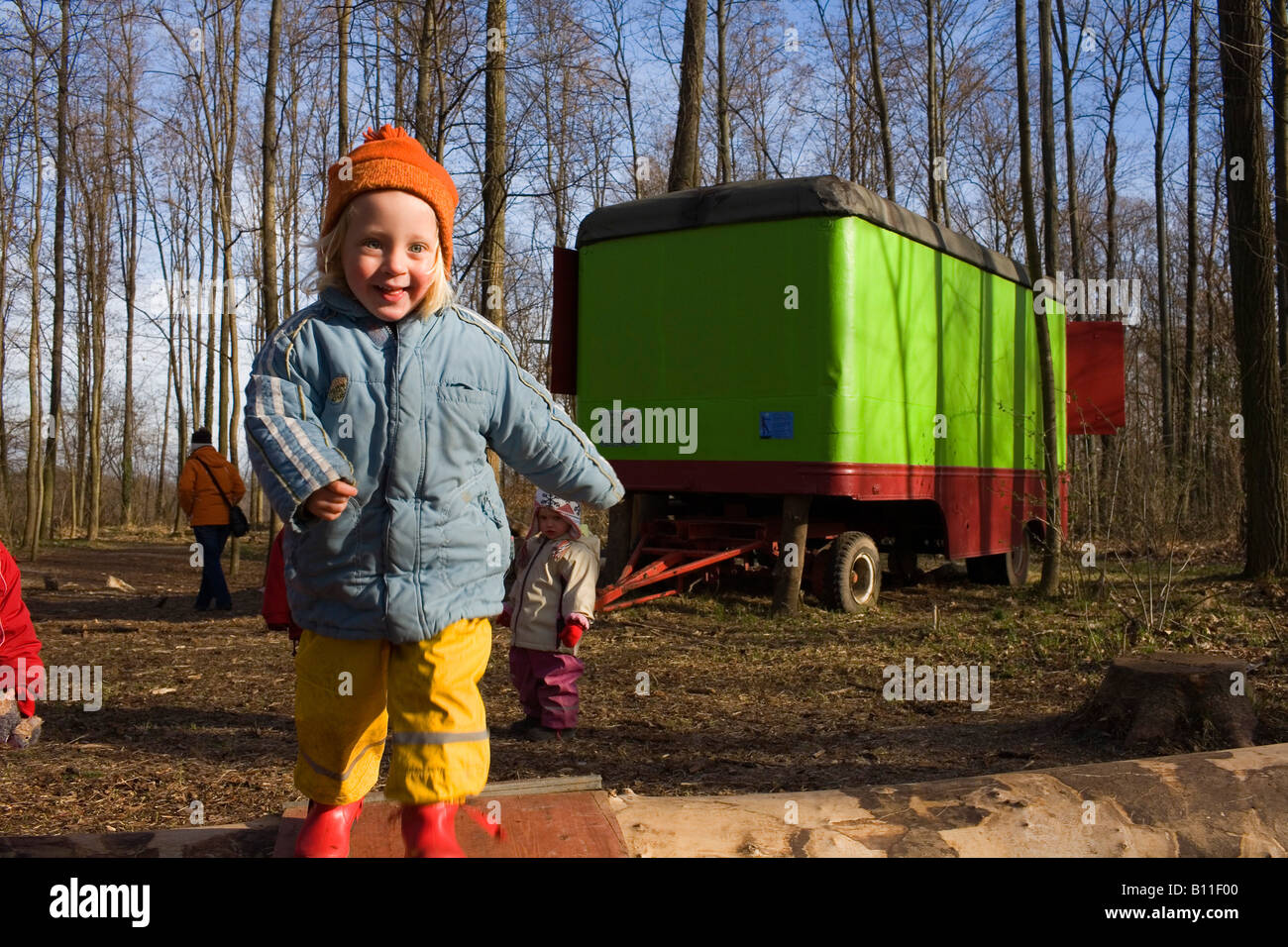 Children playing in the forest kindergarden Stock Photo - Alamy