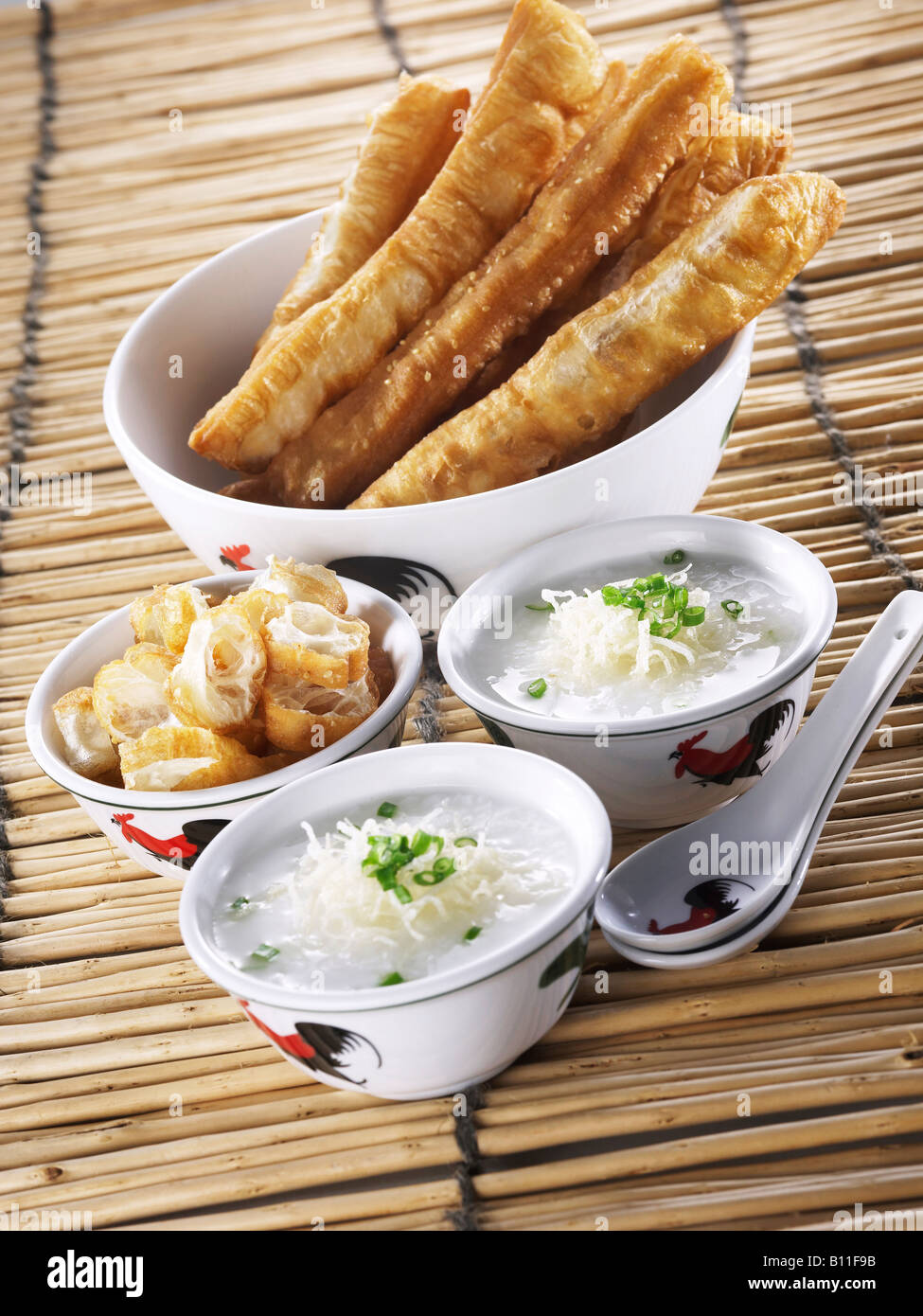 Chinese rice congee with pieces of fried bread sticks Stock Photo - Alamy
