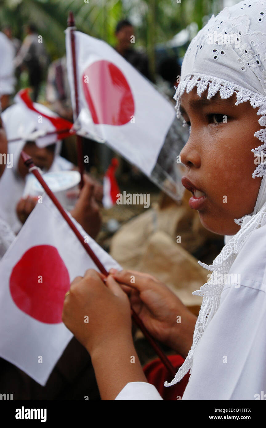 A girl with the Japanese flag in her hands Stock Photo - Alamy