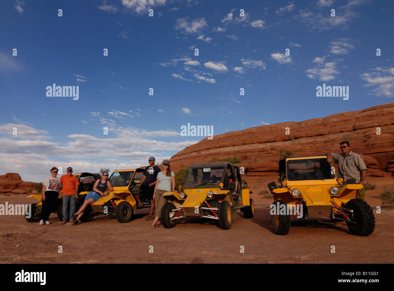 Tourist riding Tomcars little Israelian buggy jeeps Moab Utah USA MR ...
