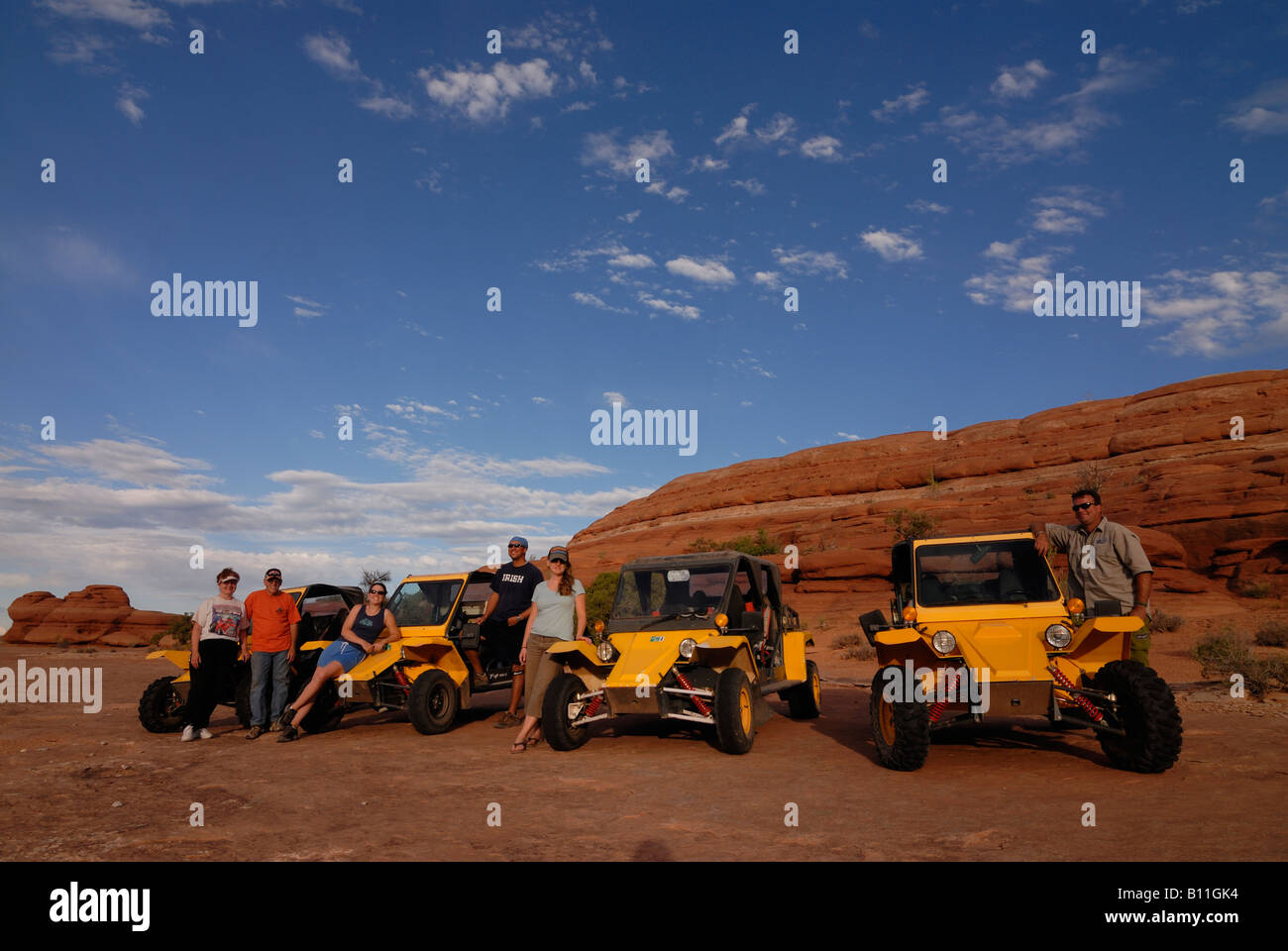 Tourist riding Tomcars little Israelian buggy jeeps Moab Utah USA MR ...