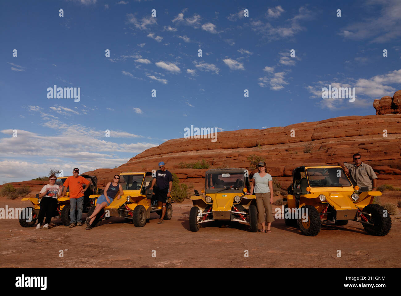 Tourist riding Tomcars little Israelian buggy jeeps Moab Utah USA MR ...