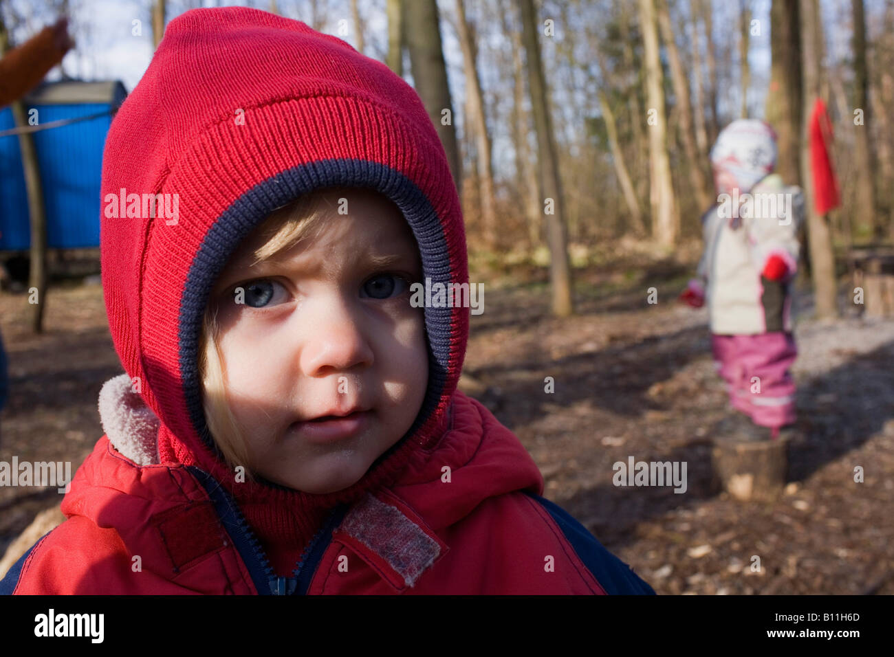 Children playing in the forest kindergarden Stock Photo - Alamy