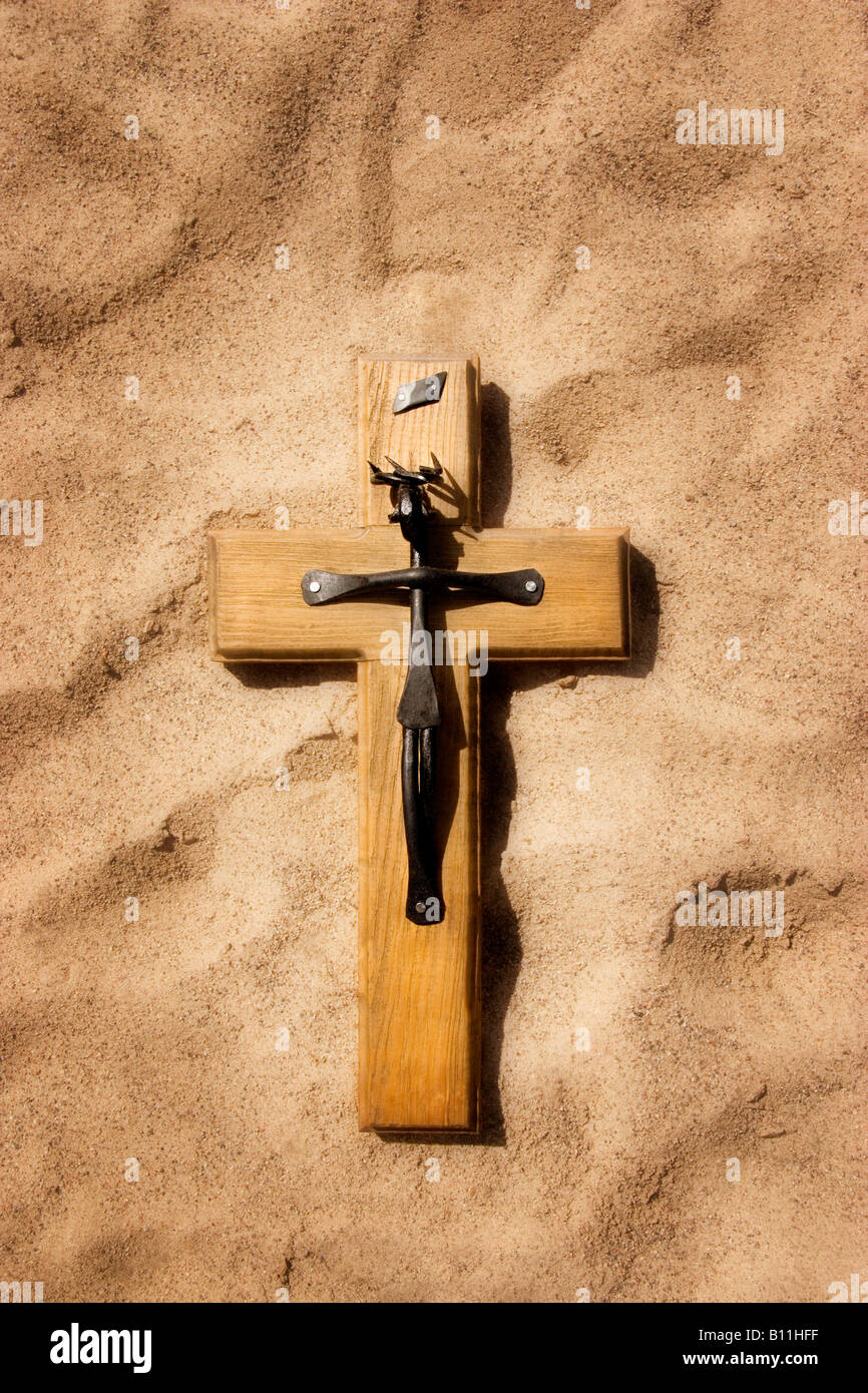 Christian cross on sand Stock Photo - Alamy