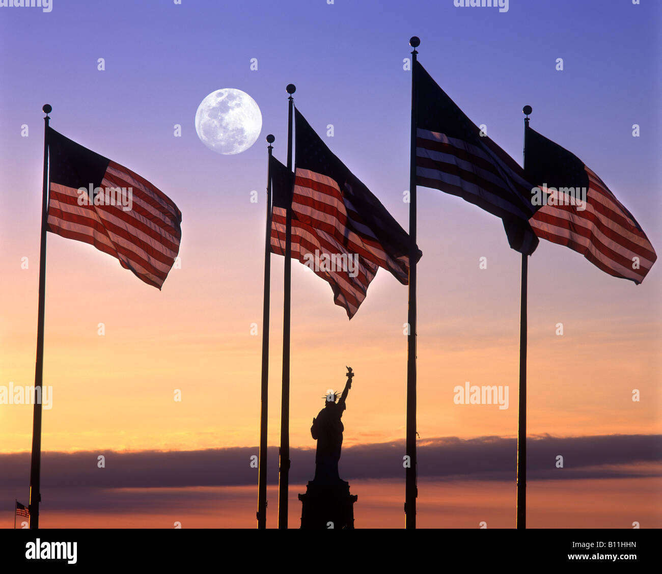 UNITED STATES FLAGS FLYING ON FLAGPOLES STATUE OF LIBERTY NEW YORK CITY ...