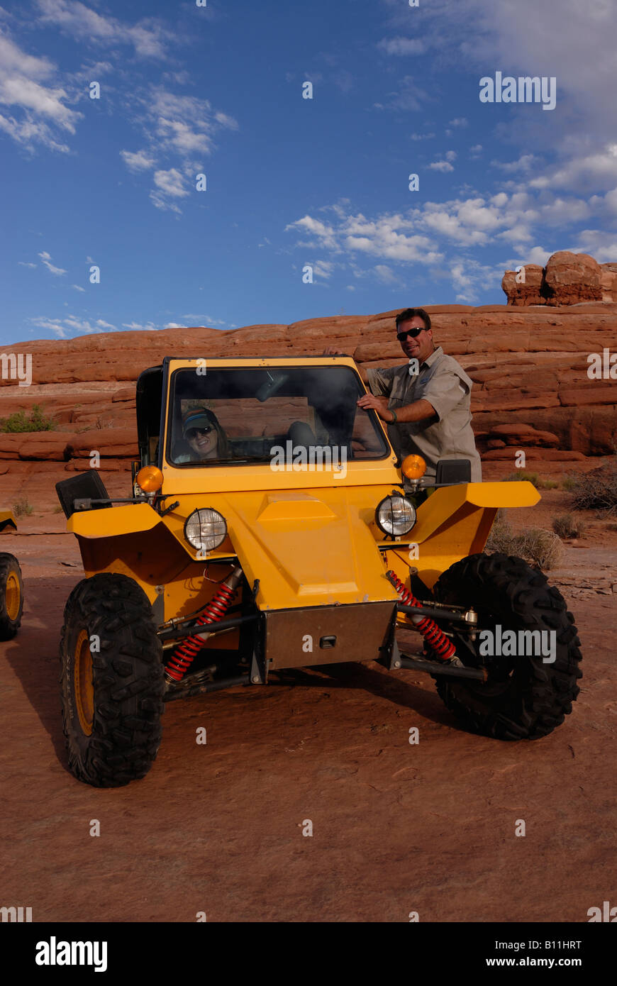 Tourist riding Tomcars little Israelian buggy jeeps Moab Utah USA MR ...