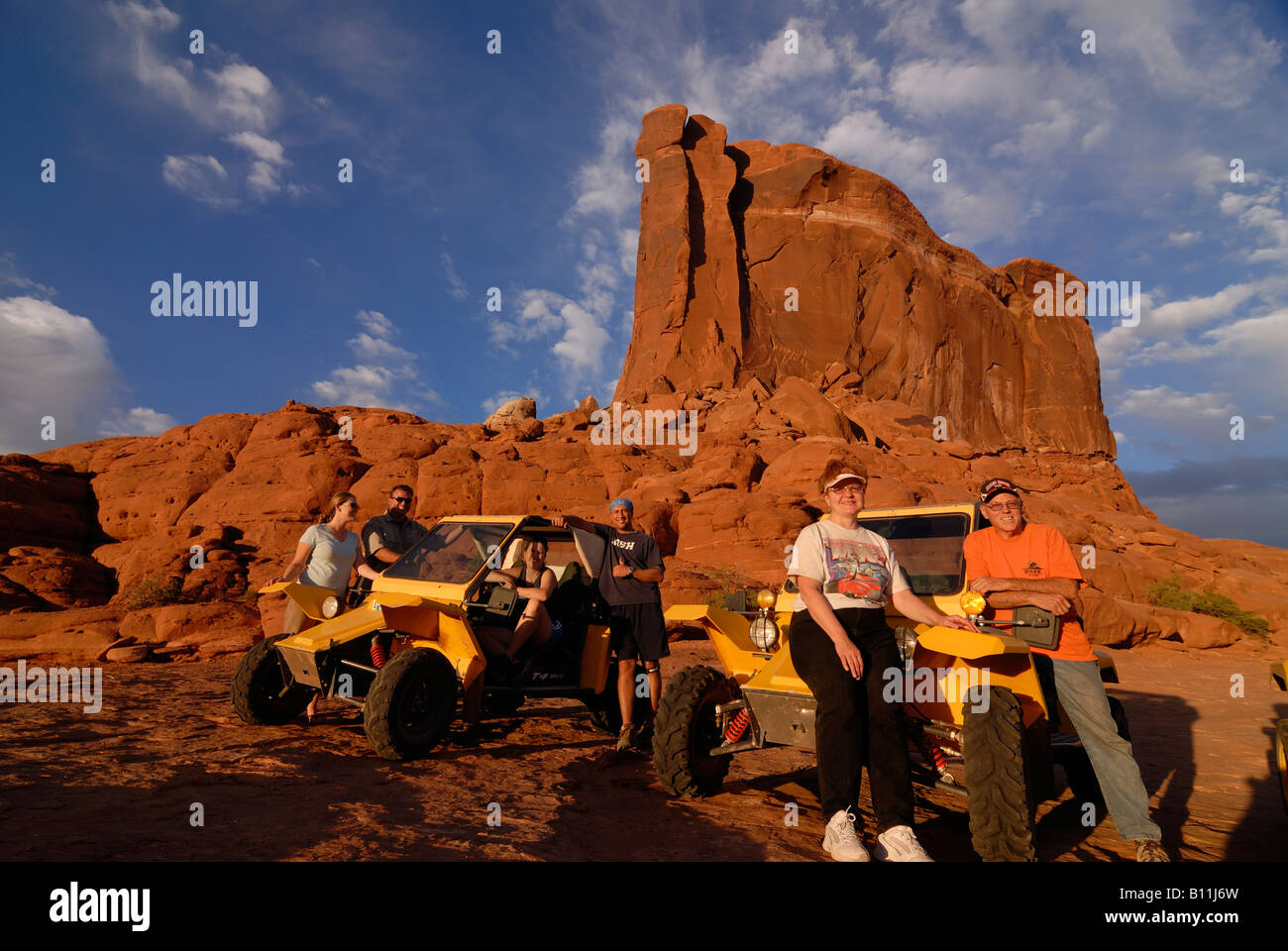 Tourist riding Tomcars little Israelian buggy jeeps Moab Utah USA MR ...