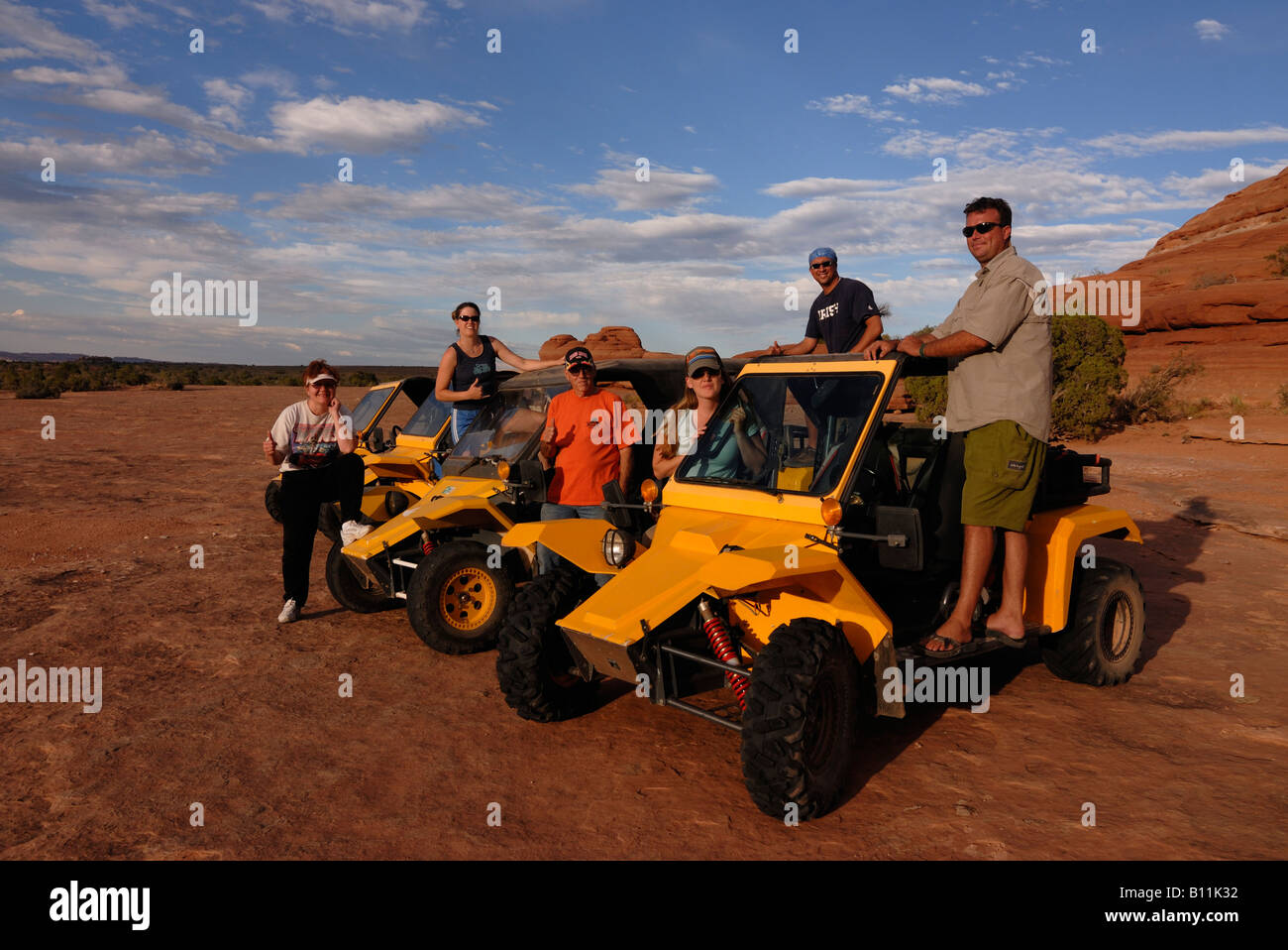 Tourist riding Tomcars little Israelian buggy jeeps Moab Utah USA MR ...