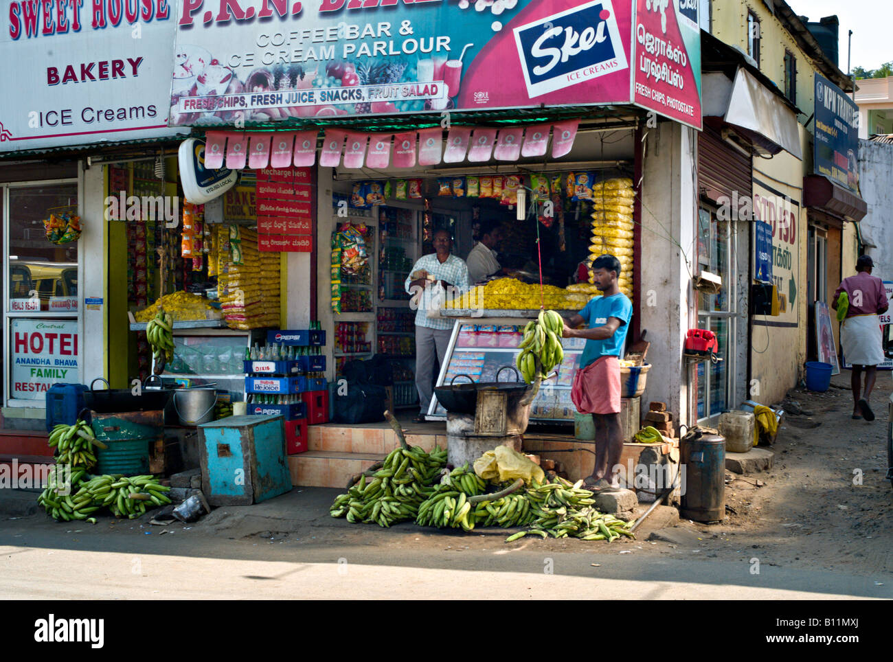 INDIA KERALA KUMILY Small shops specializing in fresh fried plantain ...