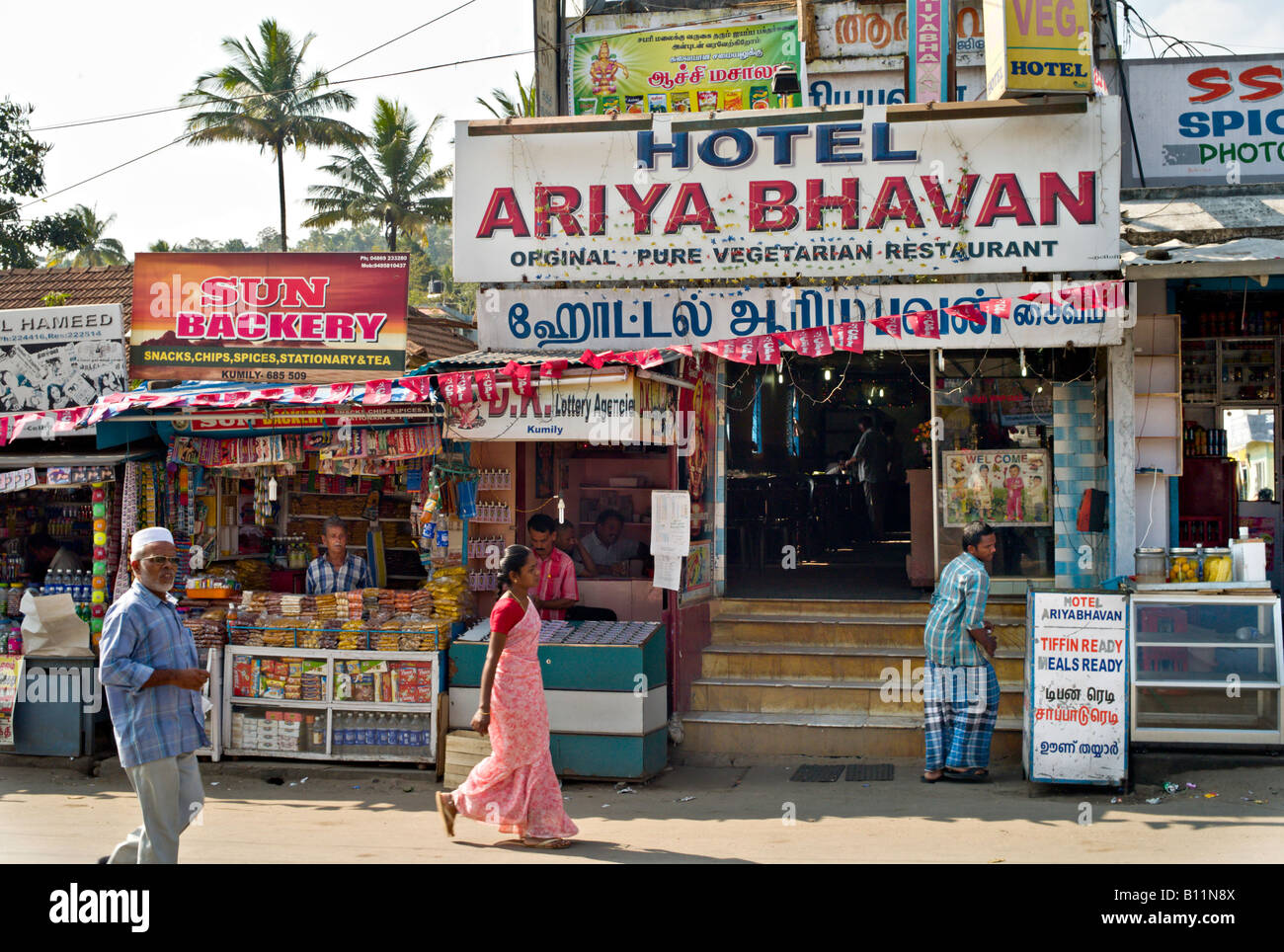 INDIA KERALA KUMILY Tiny colorful shops selling candy spices tea and ...