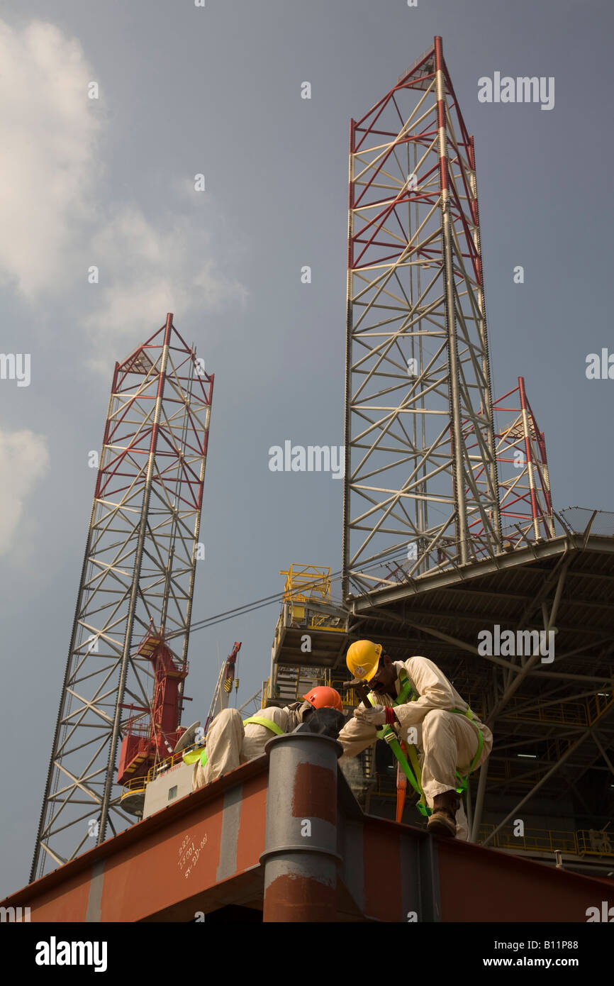 Welders welding on oil platform Port Khalid Sharjah United Arab ...