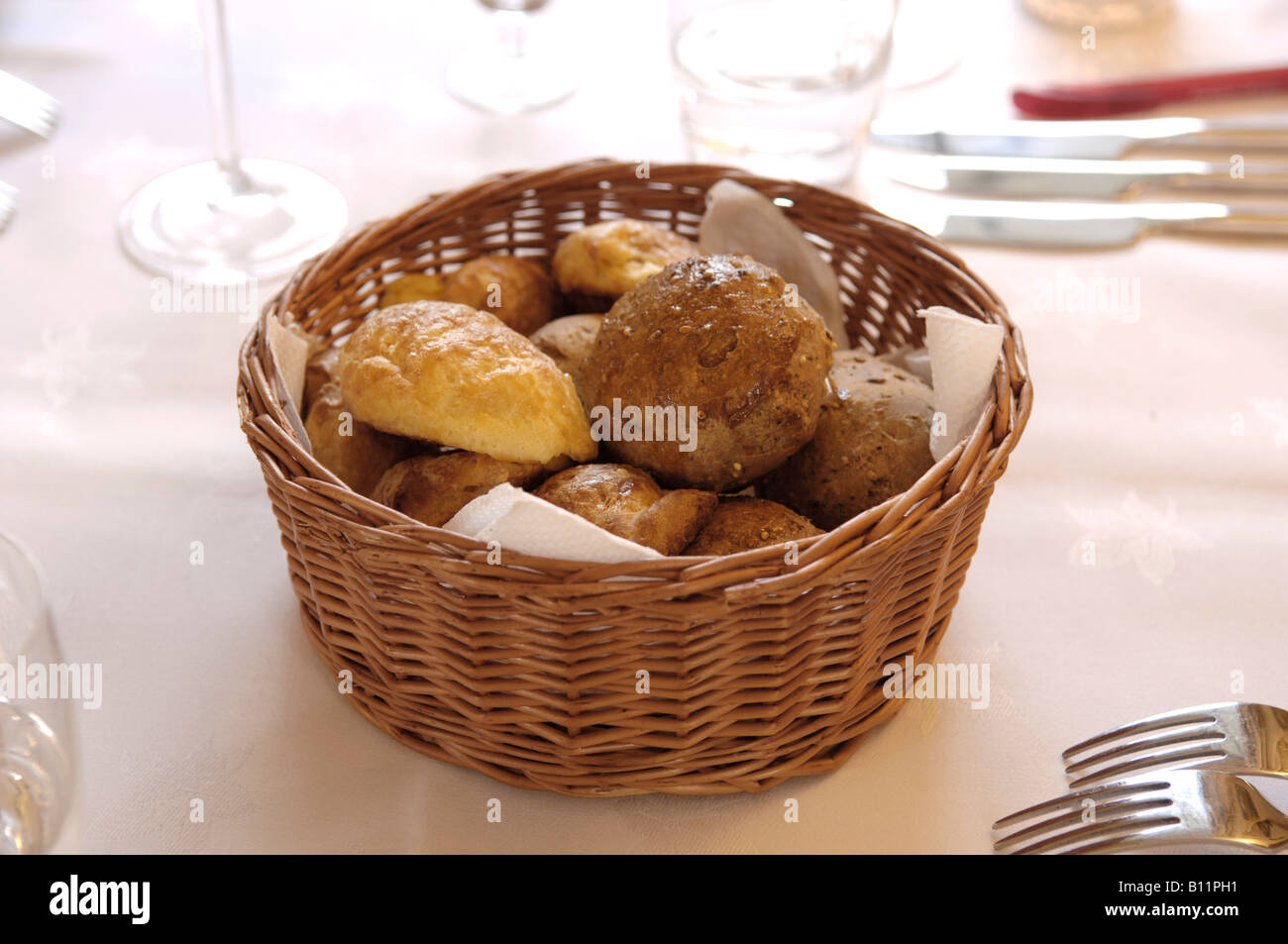 Basket of mixed breads on a restaurant table UK Stock Photo - Alamy