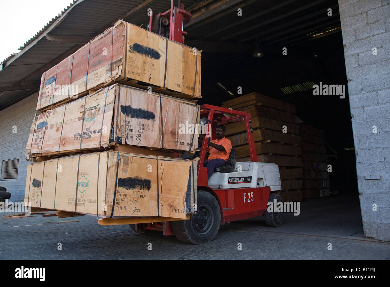 Forklift Truck operator transporting general cargo goods at Port Khalid ...