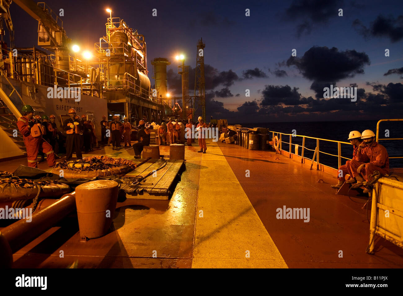 Workers waiting on the deck of a Floating Oil Production Storage and ...