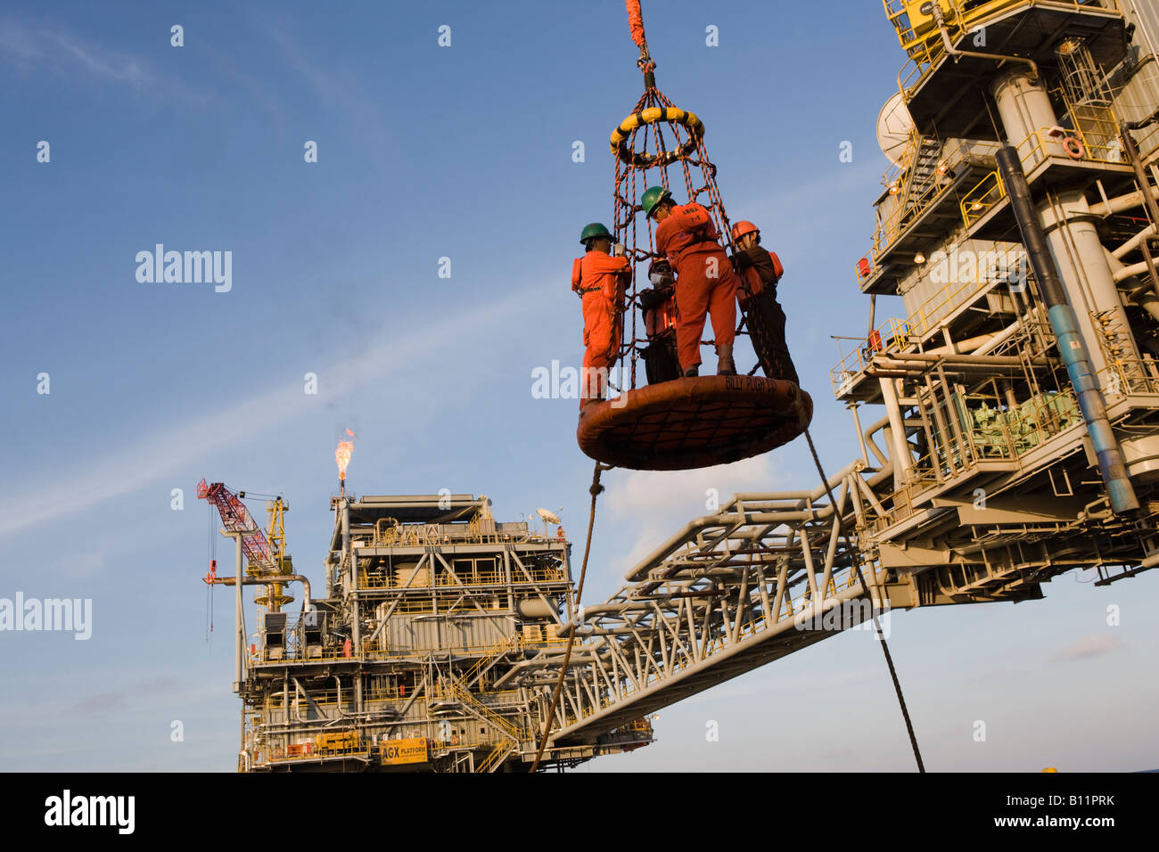 Workers being transfered by Billy Pugh from supply vessell to rig ...