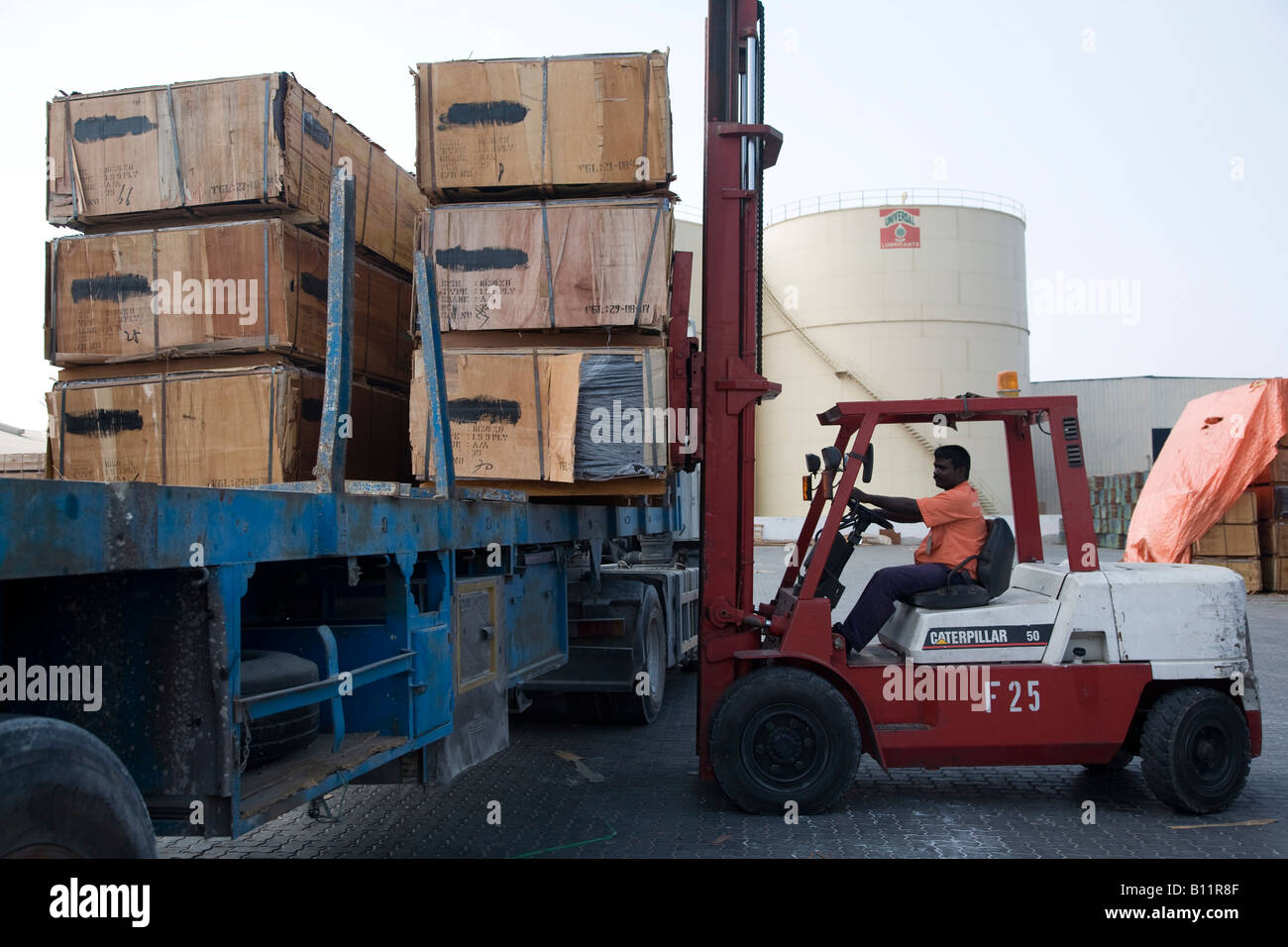 Forklift Truck operator transporting general cargo goods at Port Khalid ...