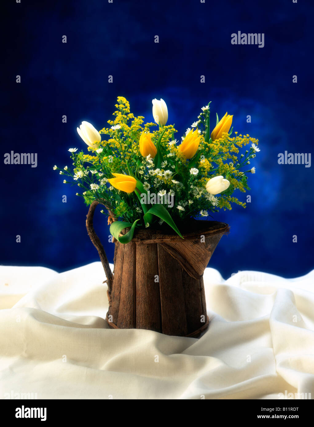 tulips and other flowers in a jug Stock Photo - Alamy