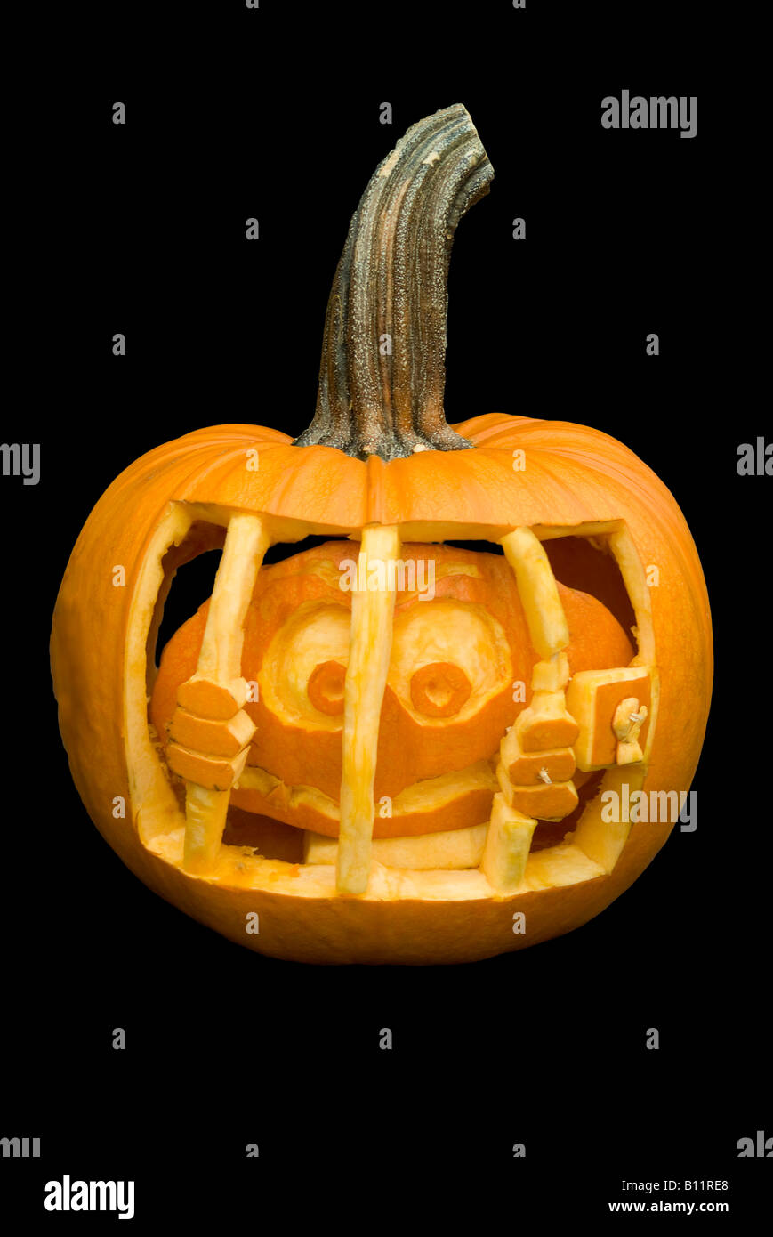 little smiling pumpkin put in a big pumpkin cut out in a funny scene ...