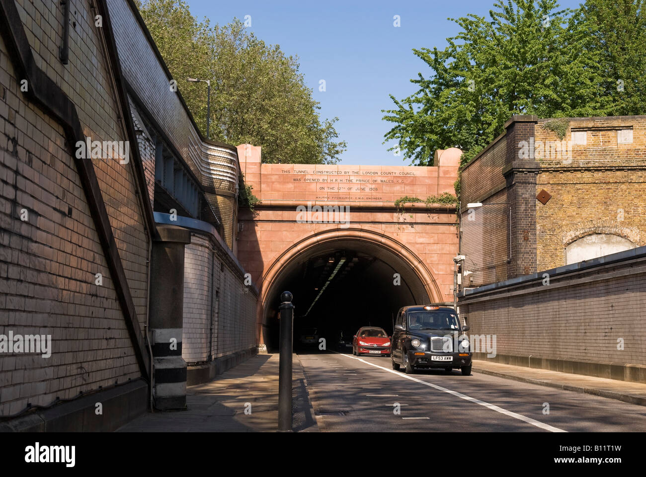 Black cab coming out of the Surrey side Rotherhithe Road Tunnel, London ...