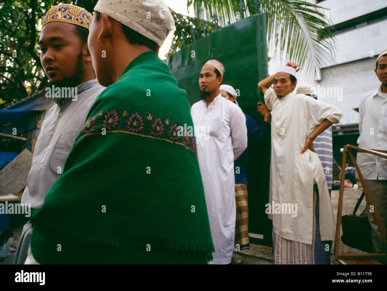 Muslim men gathering outside a building in Indonesia Stock Photo - Alamy