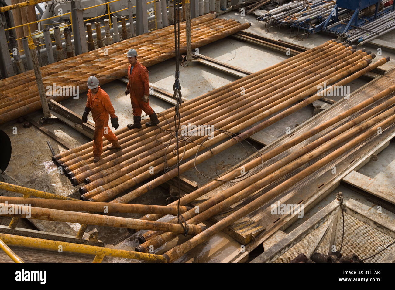 Oil workers with drills. Ensco rig. Natuna Field. Sea South China Sea ...