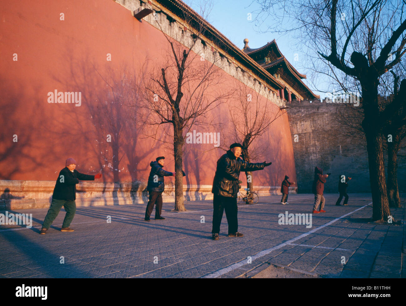 A group of elderly Chinese doing morning exercise outside the Forbidden ...