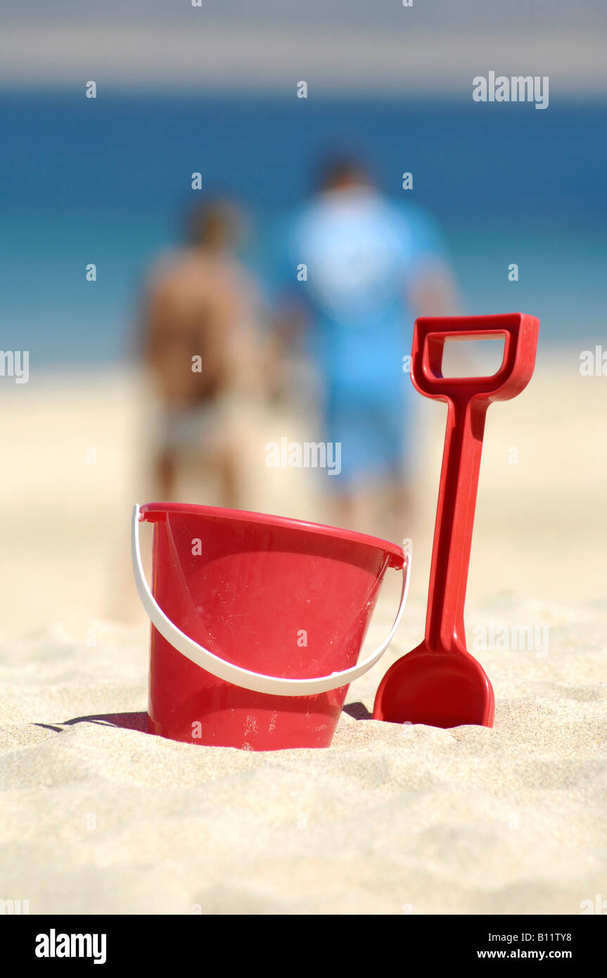 Bucket and spade on the beach UK Stock Photo - Alamy