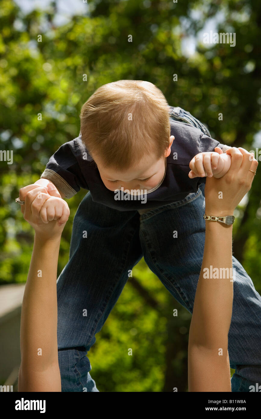 Person playing with boy Stock Photo - Alamy