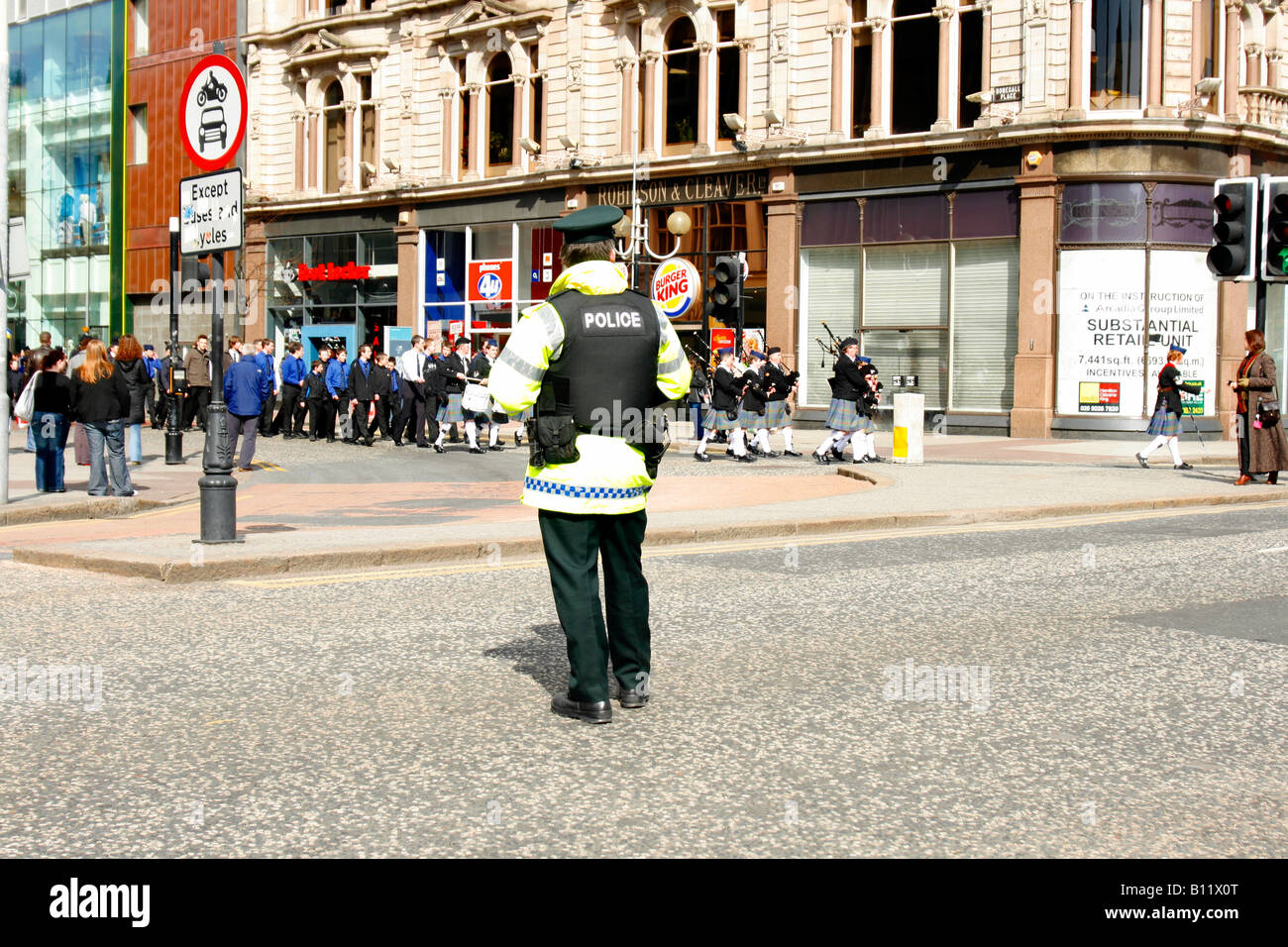 6th April 2008 Belfast policeman marshalling a boys brigade march Stock ...