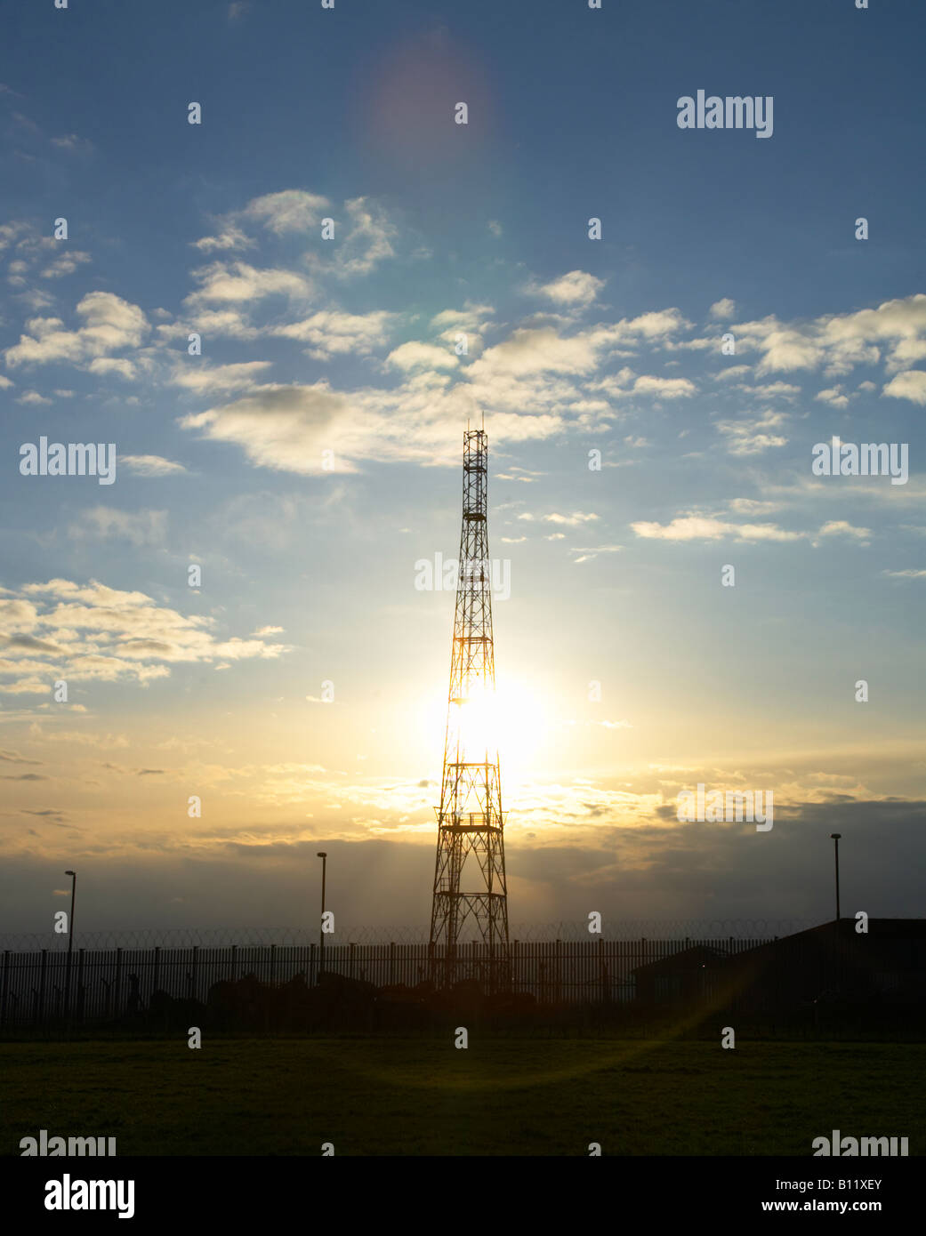 Sunset behind aerial tower Stock Photo - Alamy