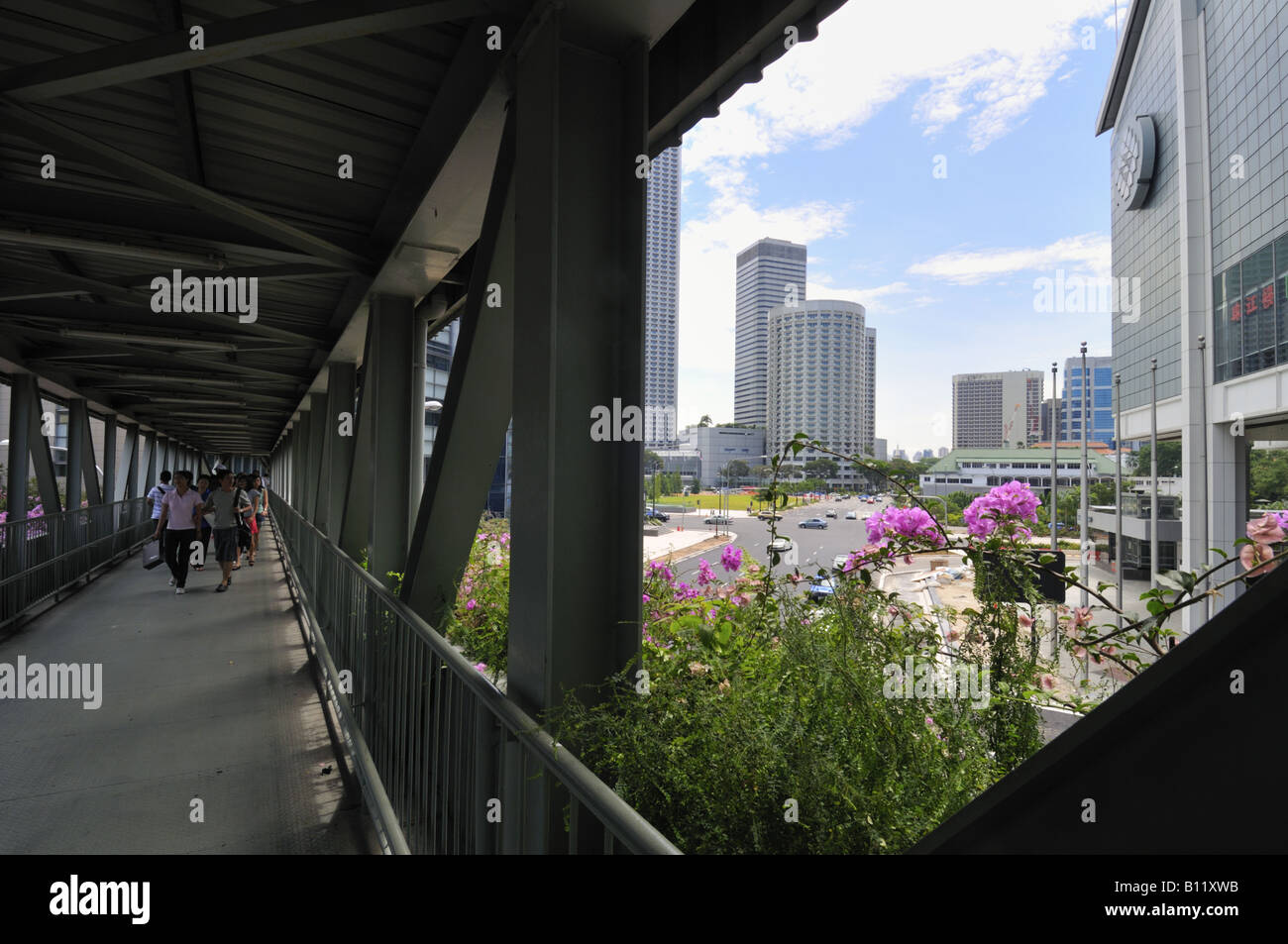 Covered pedestrian bridge over Raffles Boulevard by Suntec Singapore ...