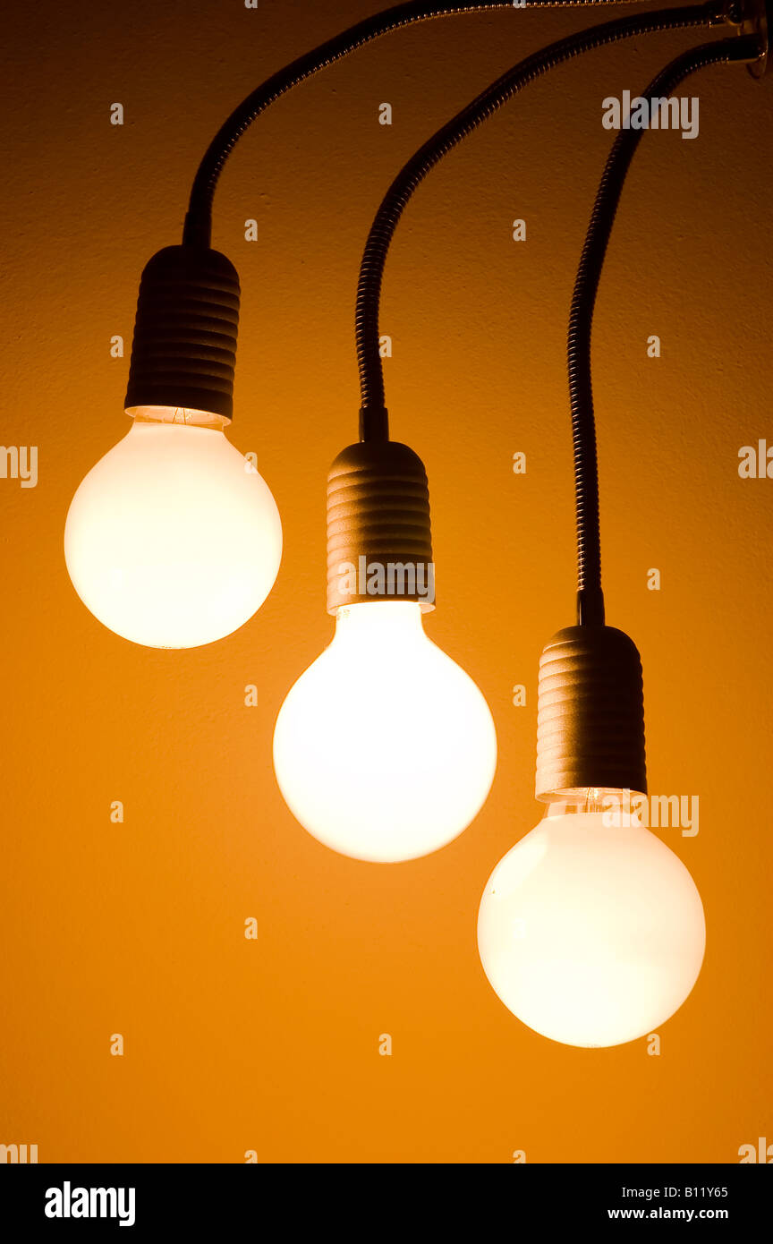 Modern chandelier with three tungsten light bulbs Stock Photo - Alamy