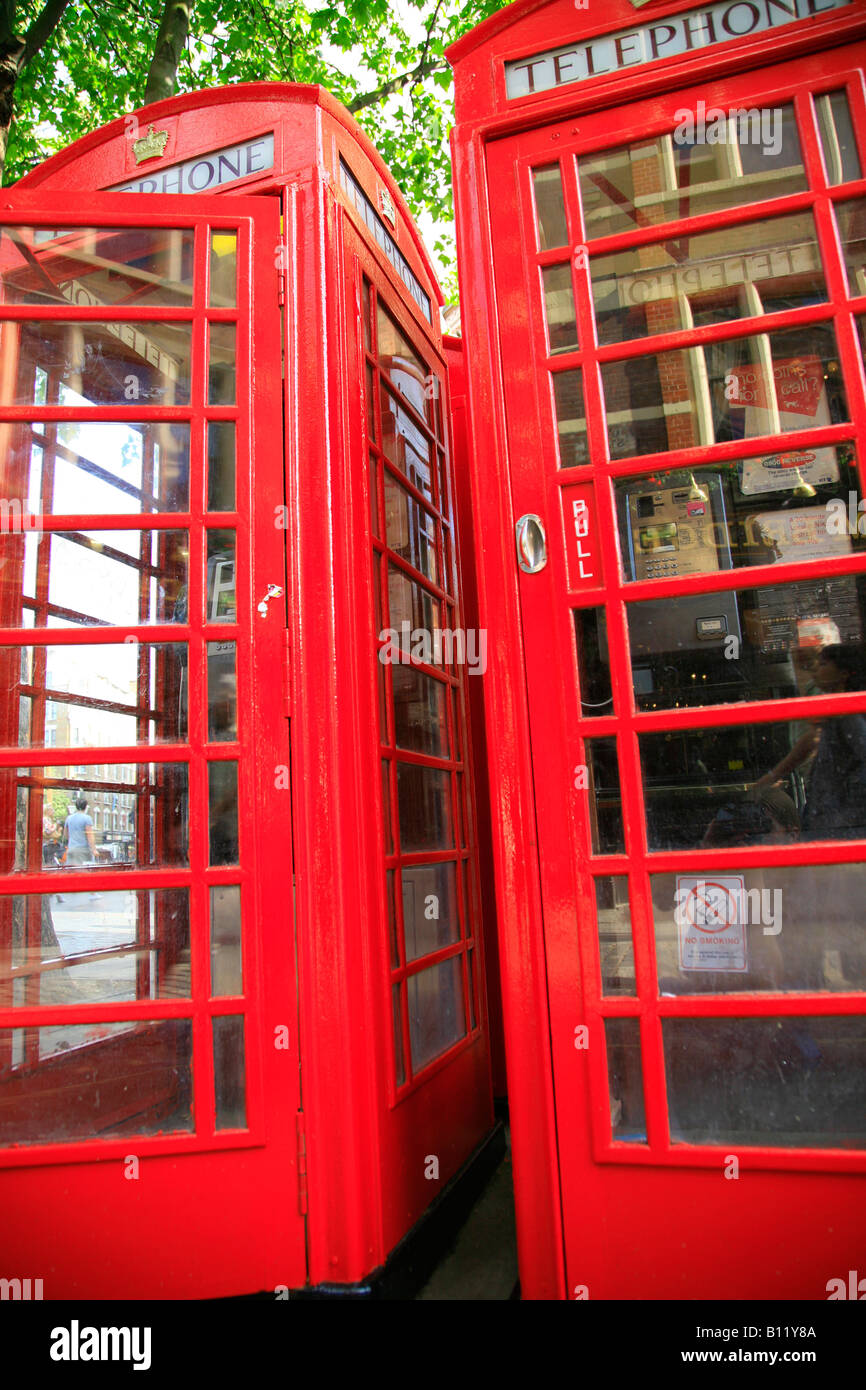Telephone boxes with open door Stock Photo - Alamy