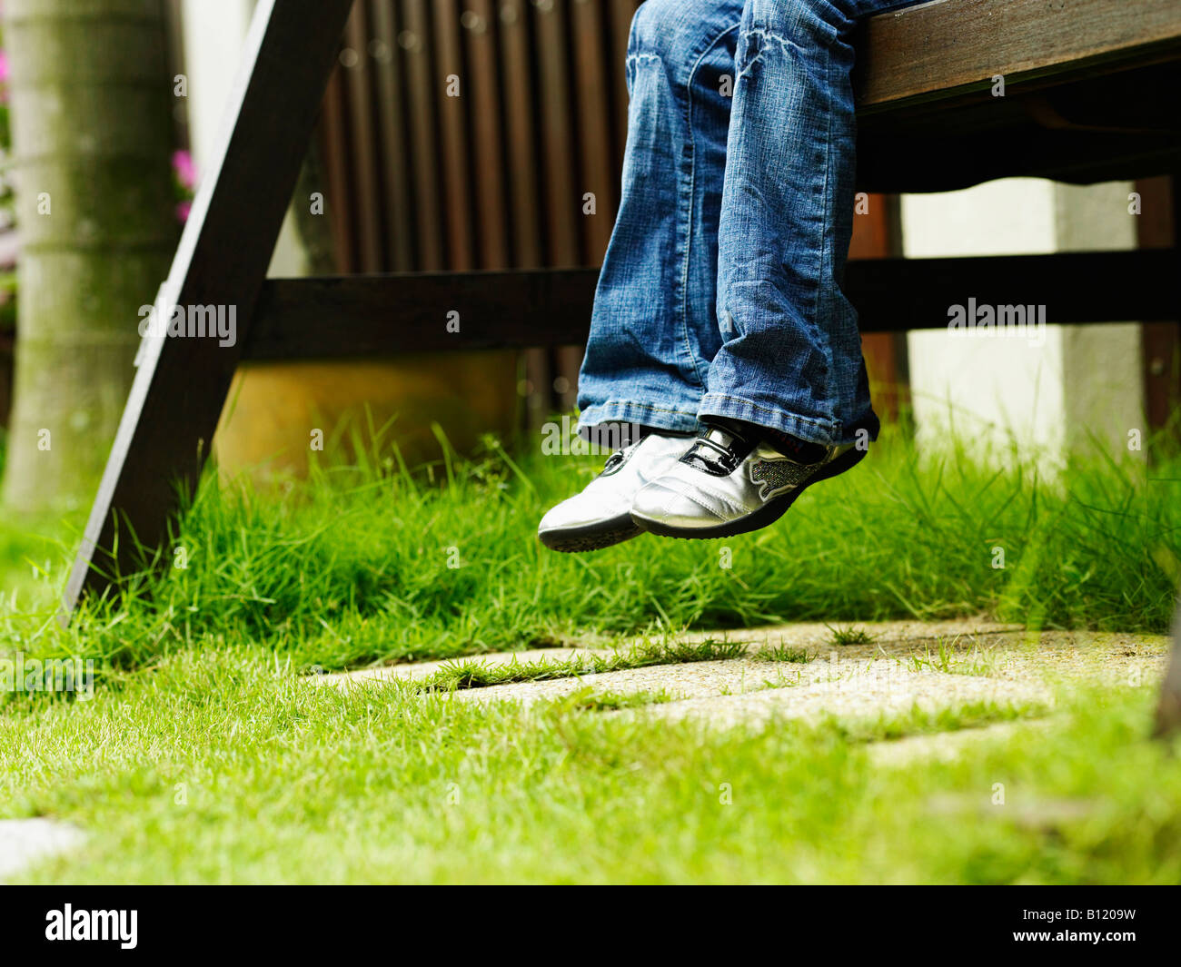 Pair of feet dangling Stock Photo - Alamy