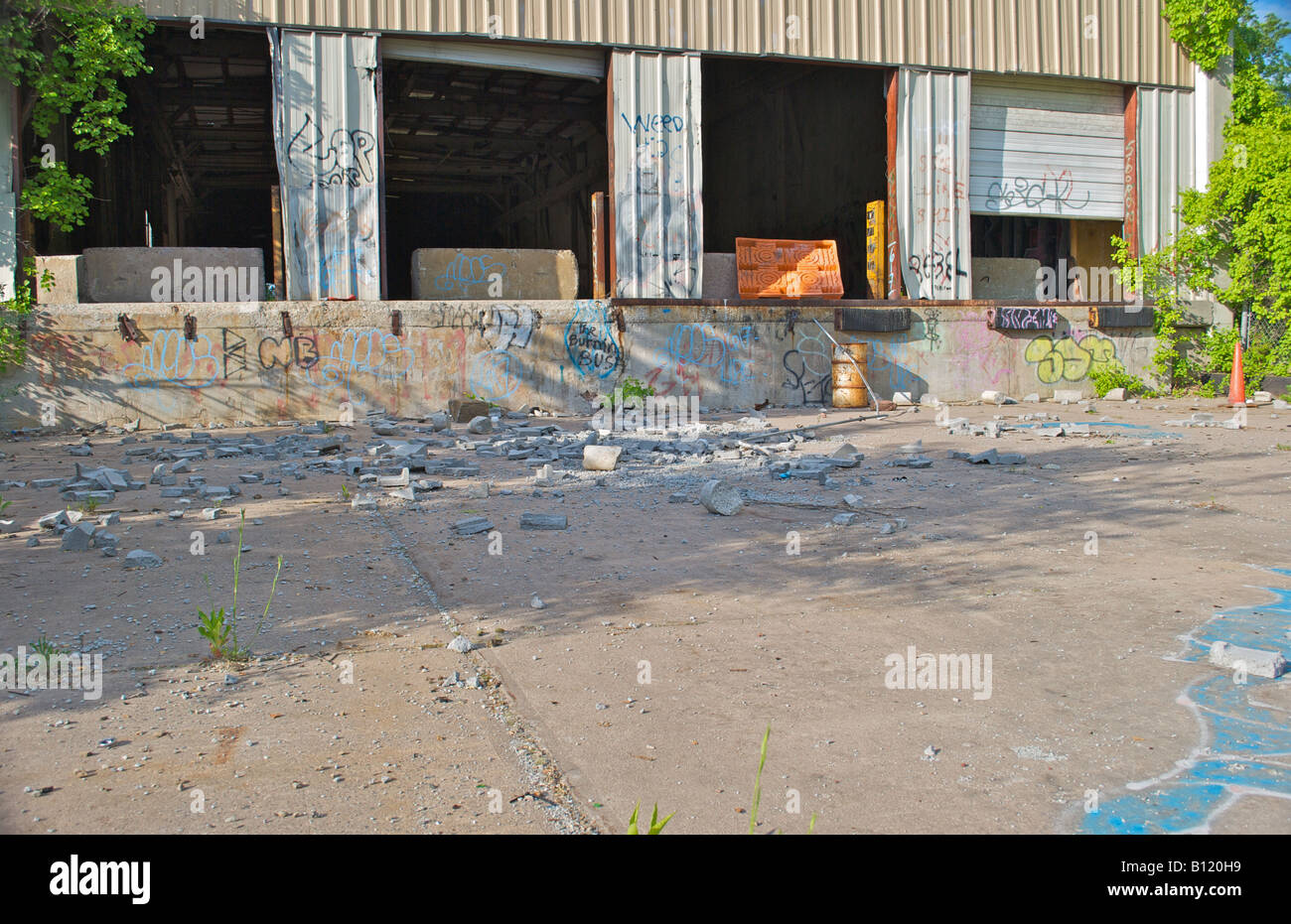 wide open dock on an abandoned factory building sprayed with graffiti ...