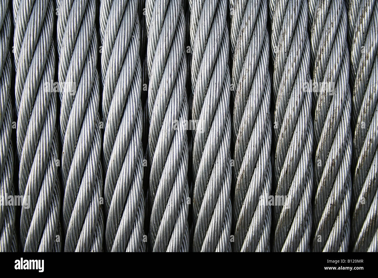 Coiled stainless steel wire cable/rope Stock Photo - Alamy
